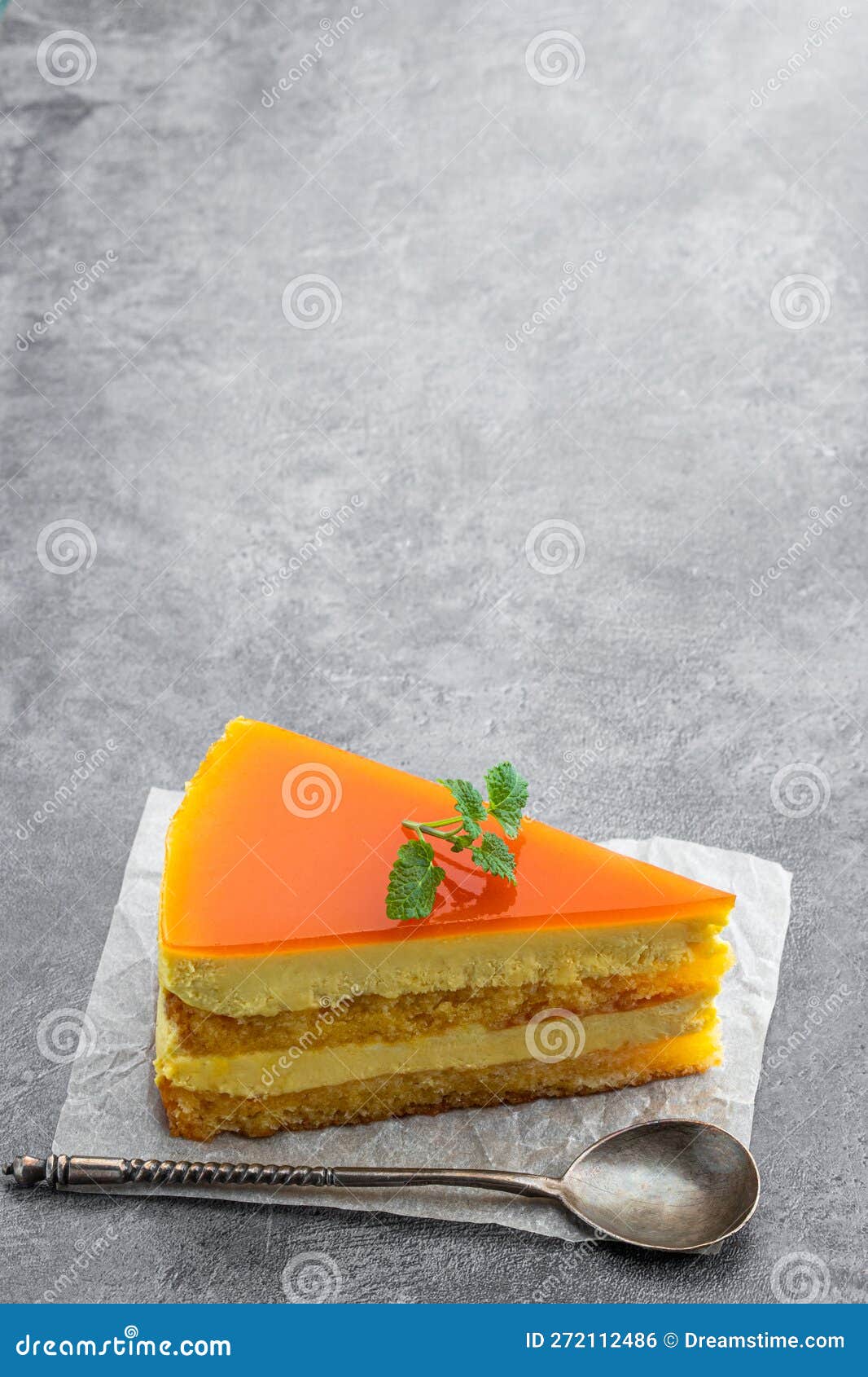 Slice of Layered Mango Cheesecake on Gray Background Stock Photo ...