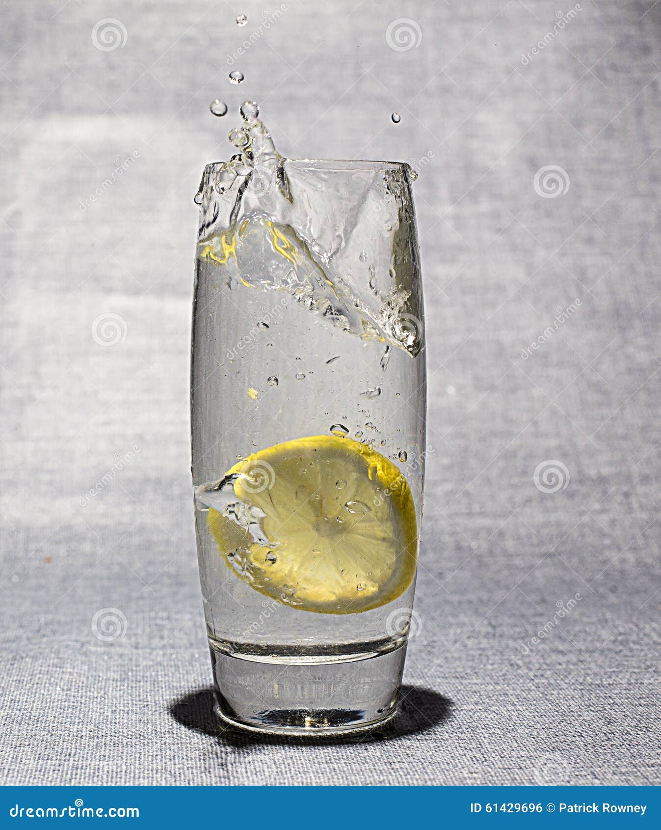 Lemon Dropped Into A Glass Of Water Royalty-Free Stock Photography ...
