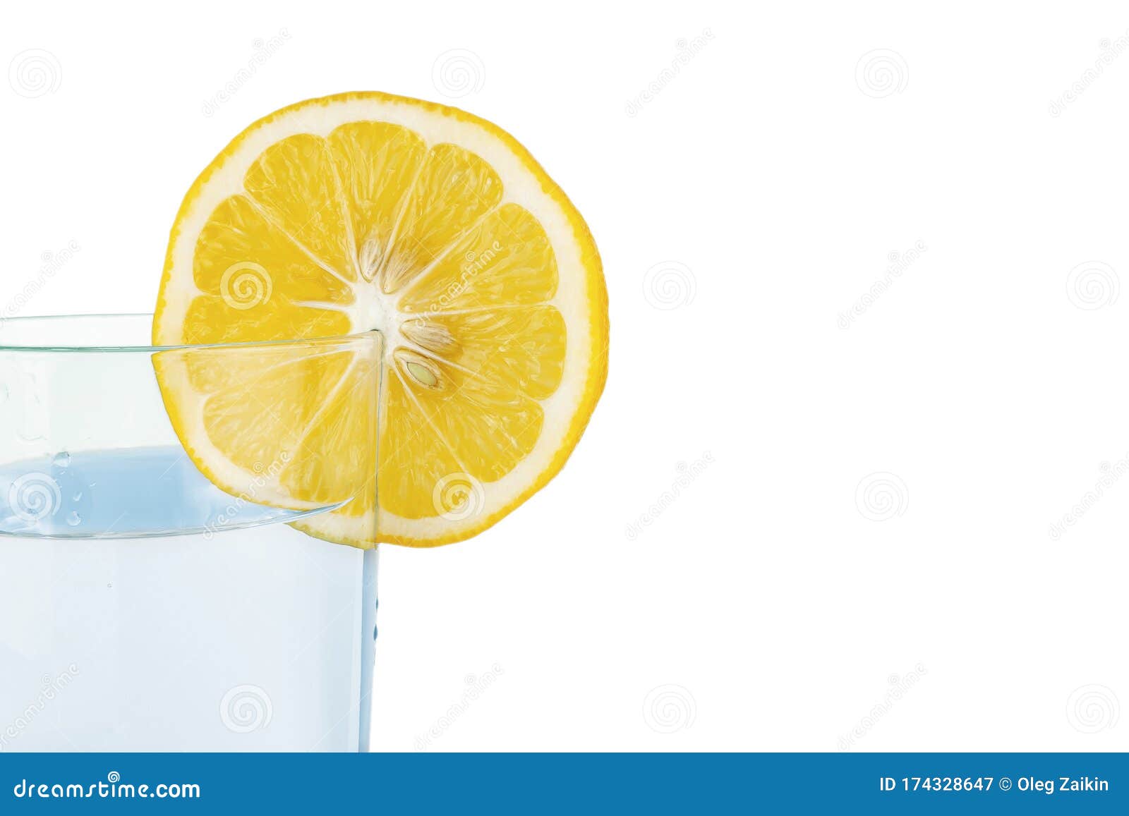 A Slice of Lemon Planted on the Edge of a Glass of Water Stock Image ...