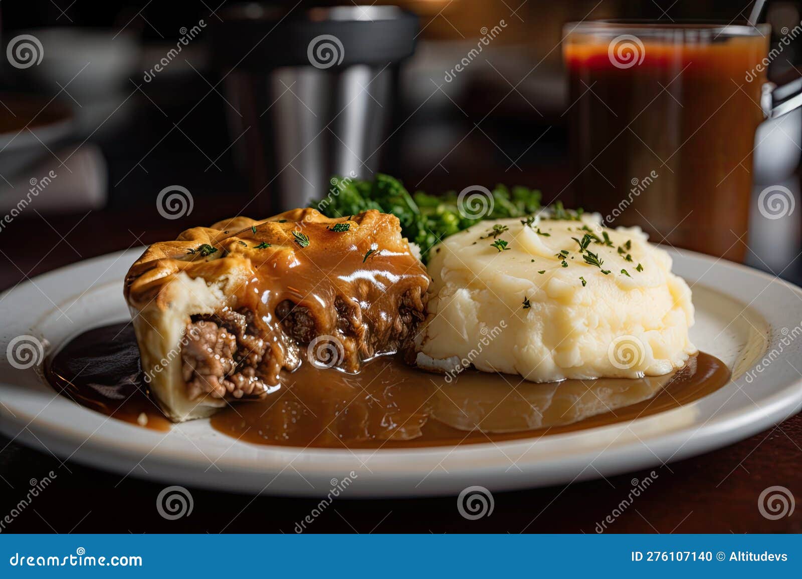 A Slice of Meat Pie with a Side of Mashed Potatoes and Gravy Stock ...