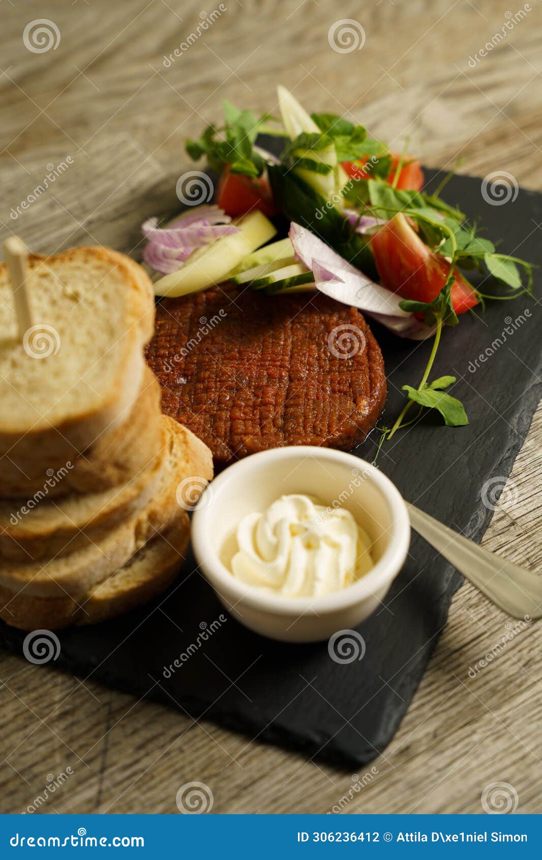 Slice of Meat with Vegetables and Baguette on a Plate Stock Photo ...