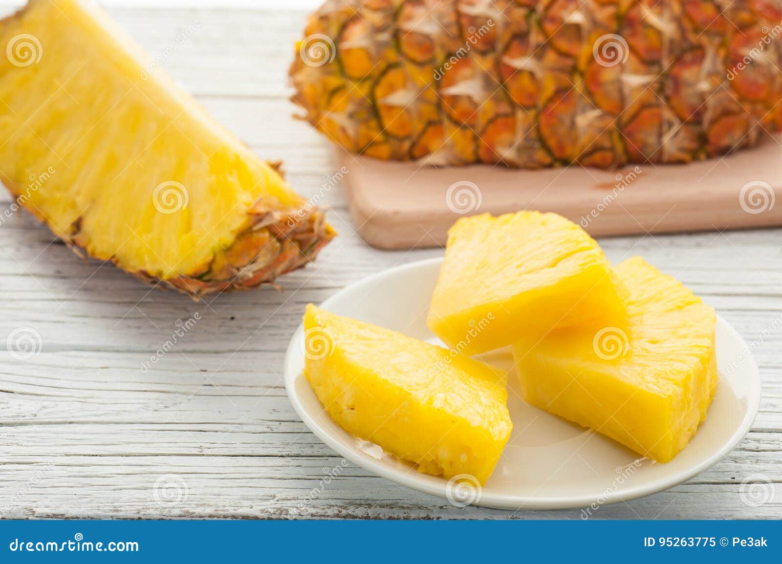 Slice of Pineapple in White Plate on Wooden Table Stock Image - Image ...
