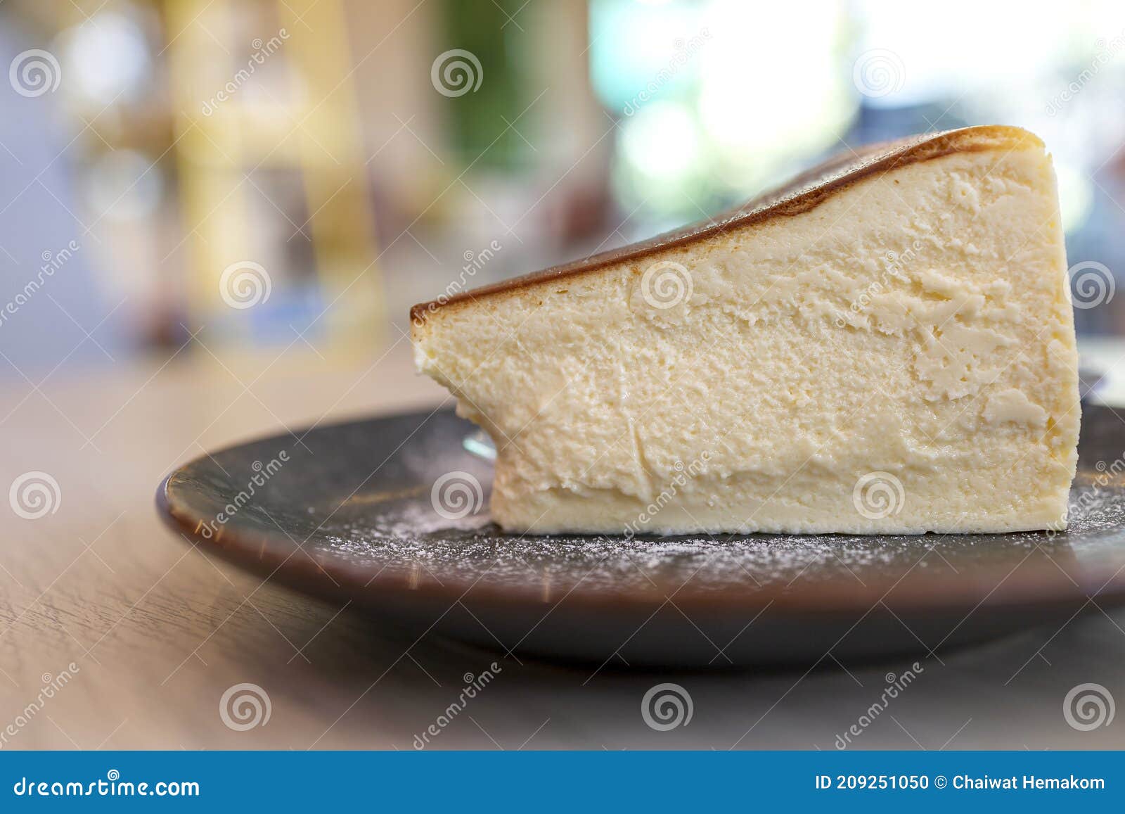 Slice of Plain Cheesecake on Ceramic Plate on Wooden Table Stock Photo ...