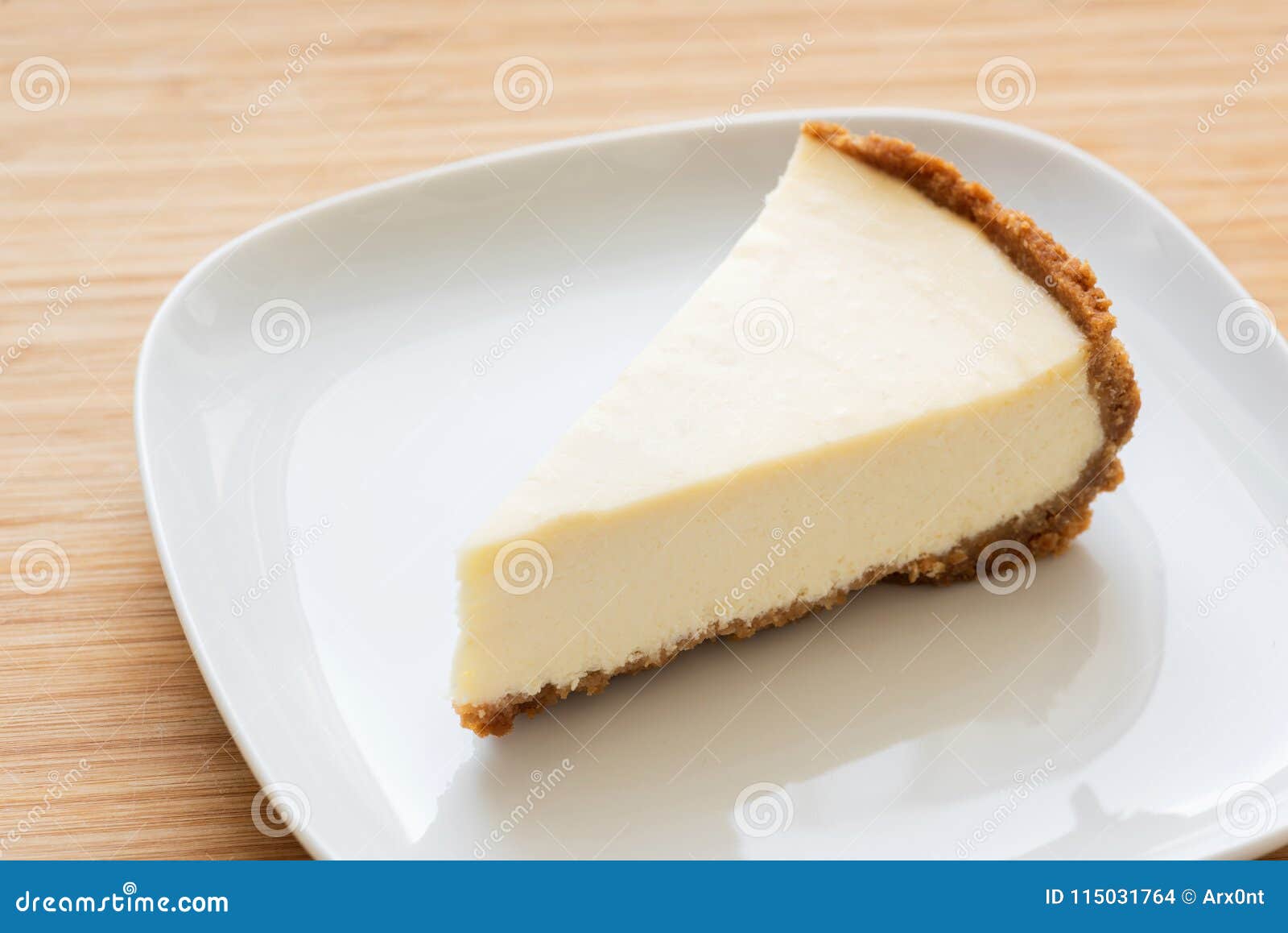Slice of Plain Classical Cheesecake on White Plate Stock Photo - Image ...