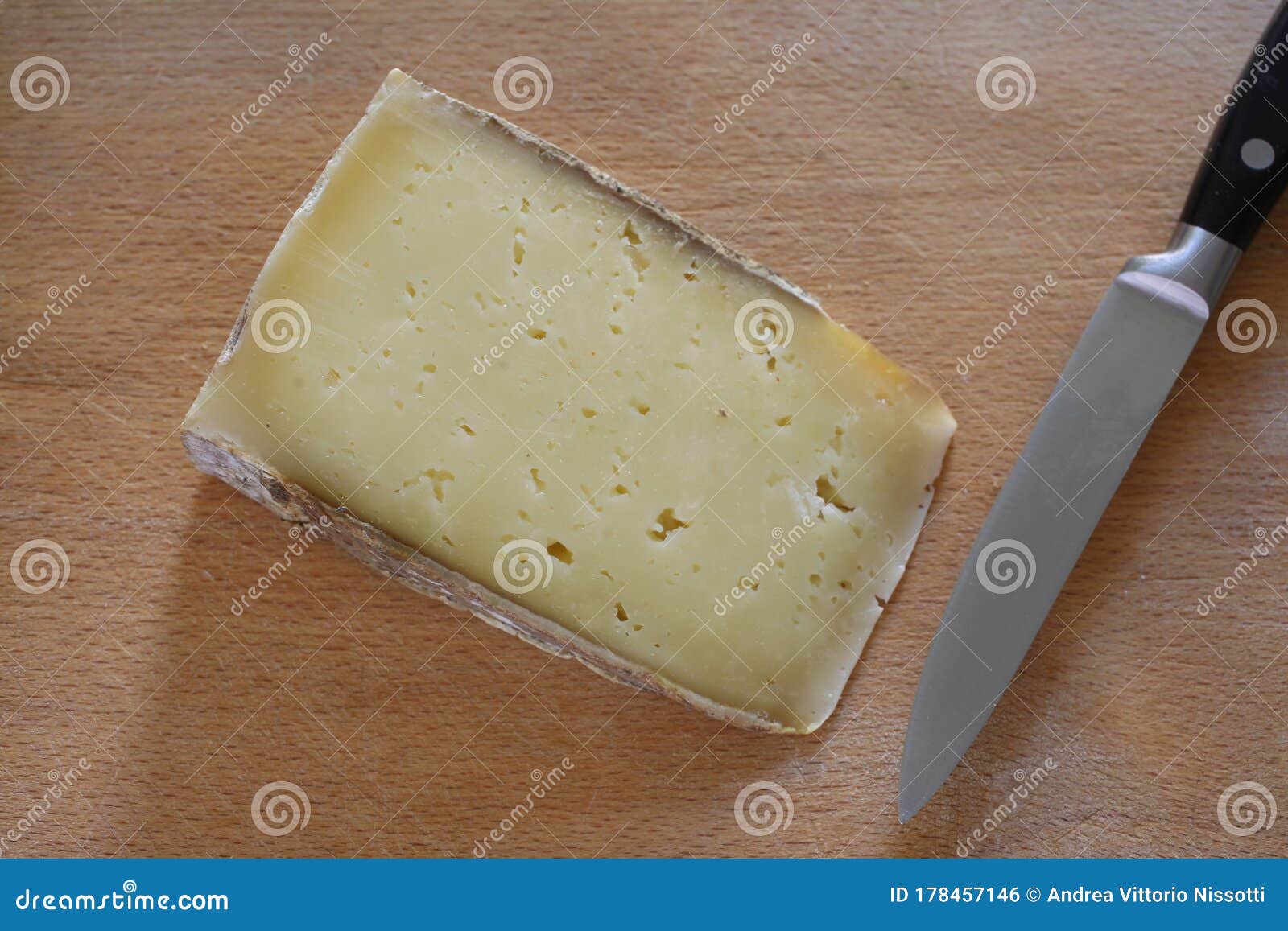 Slice of Seasoned Cheese Rest on a Wooden Table with Copy Space for ...