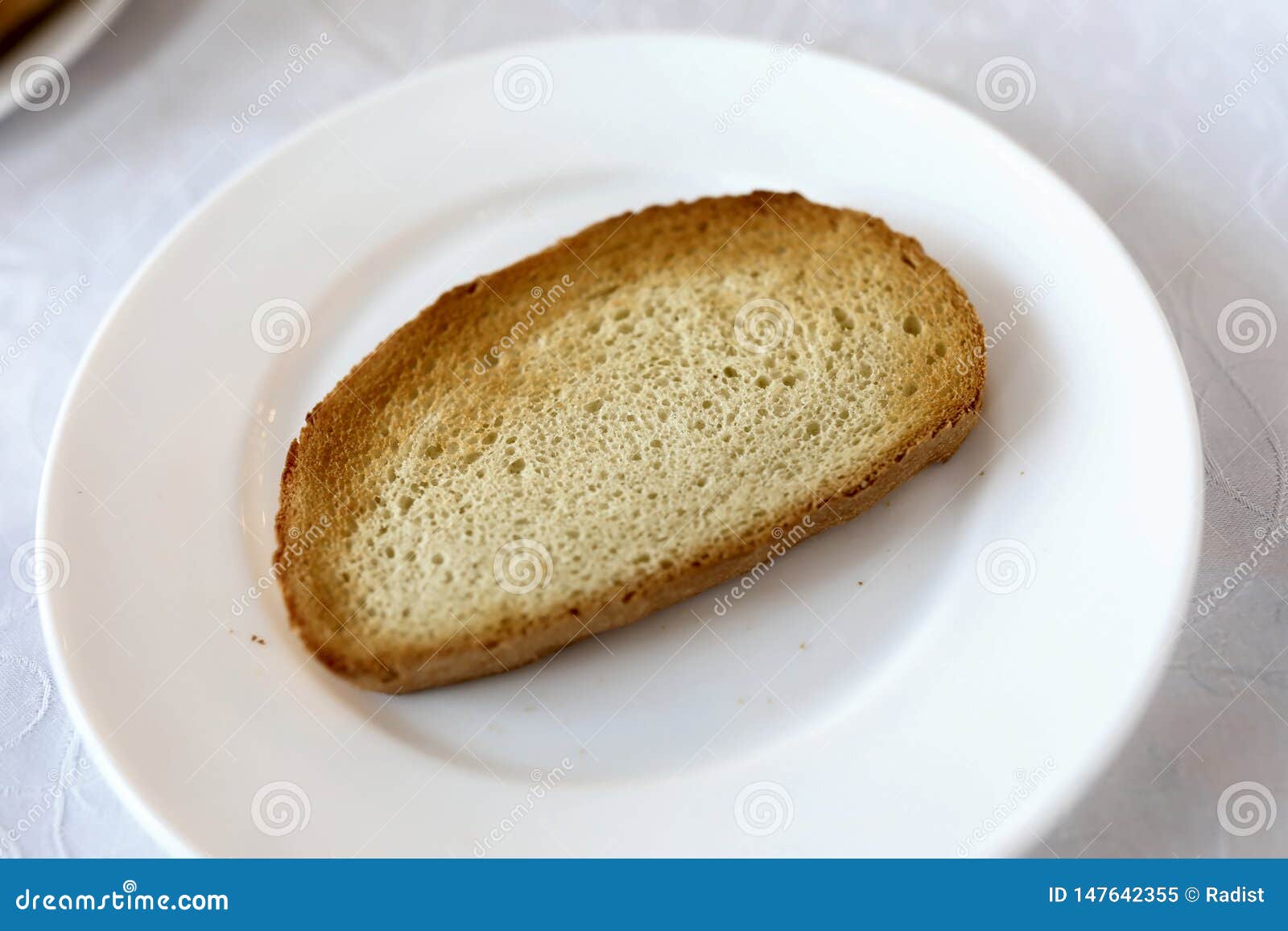 Slice of toast on plate stock image. Image of nutrition - 147642355