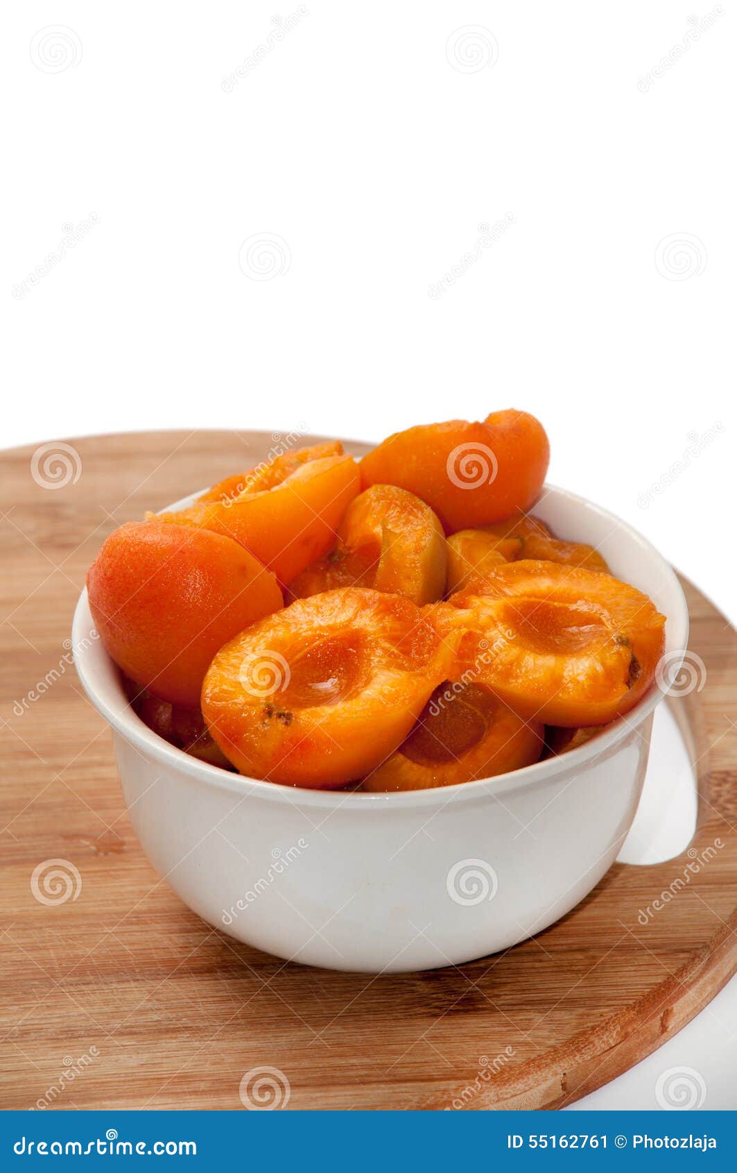 Sliced Apricots in the White Bowl on the Wooden Board Stock Image ...