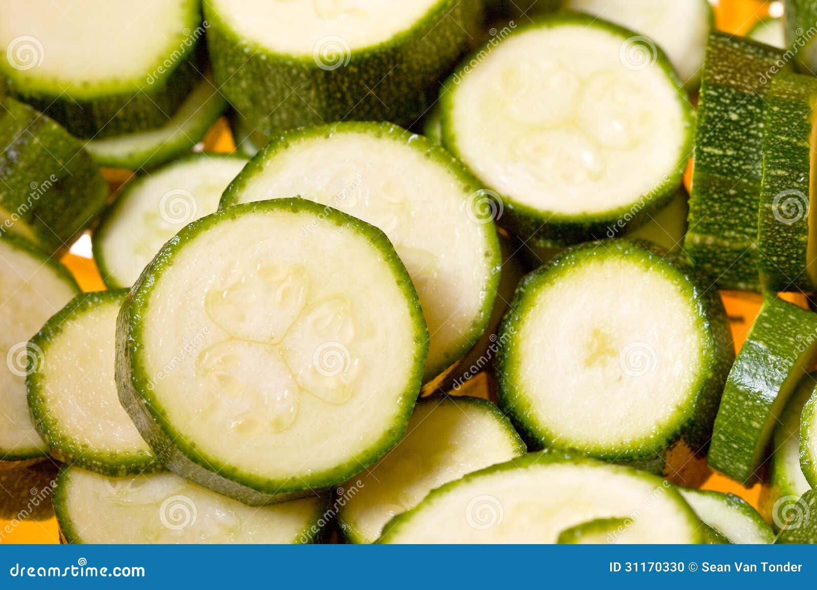 Sliced Baby Marrow in a Orange Bowl Stock Photo - Image of ingredient ...