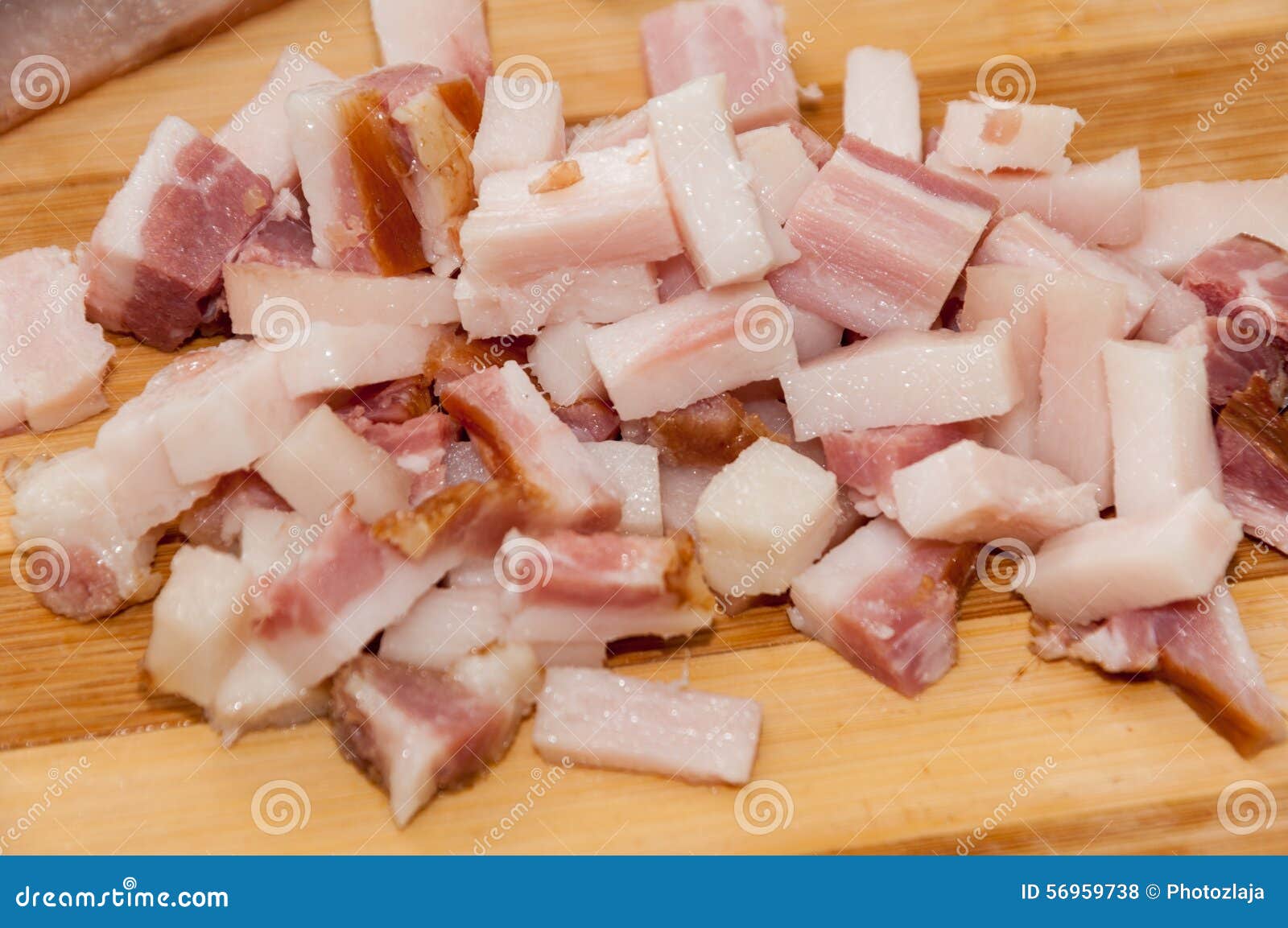Sliced Bacon Cubes on the Wooden Cutting Board Stock Photo - Image of ...