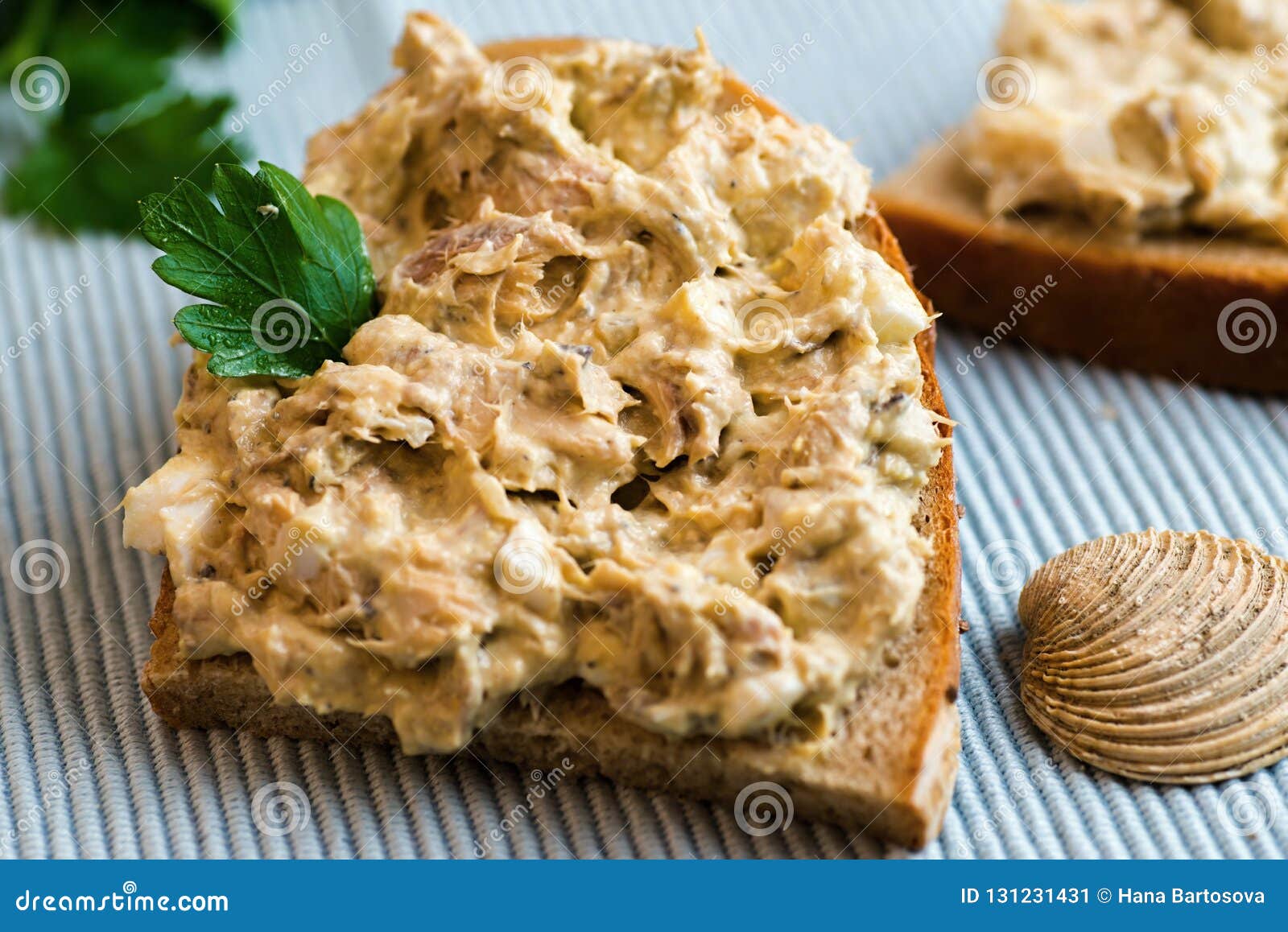 Sliced Bread with Fish Spread,leaf,shell on Blue. Stock Image - Image ...