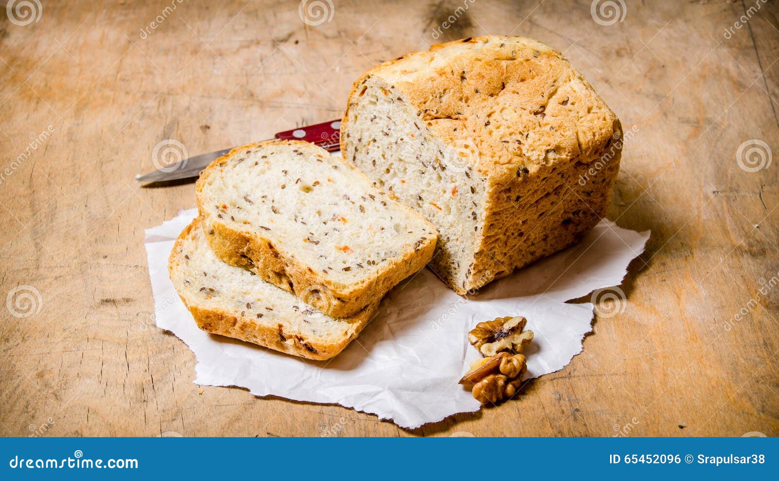 Sliced Bread on Paper. on Wooden Table. Stock Photo - Image of cutting ...