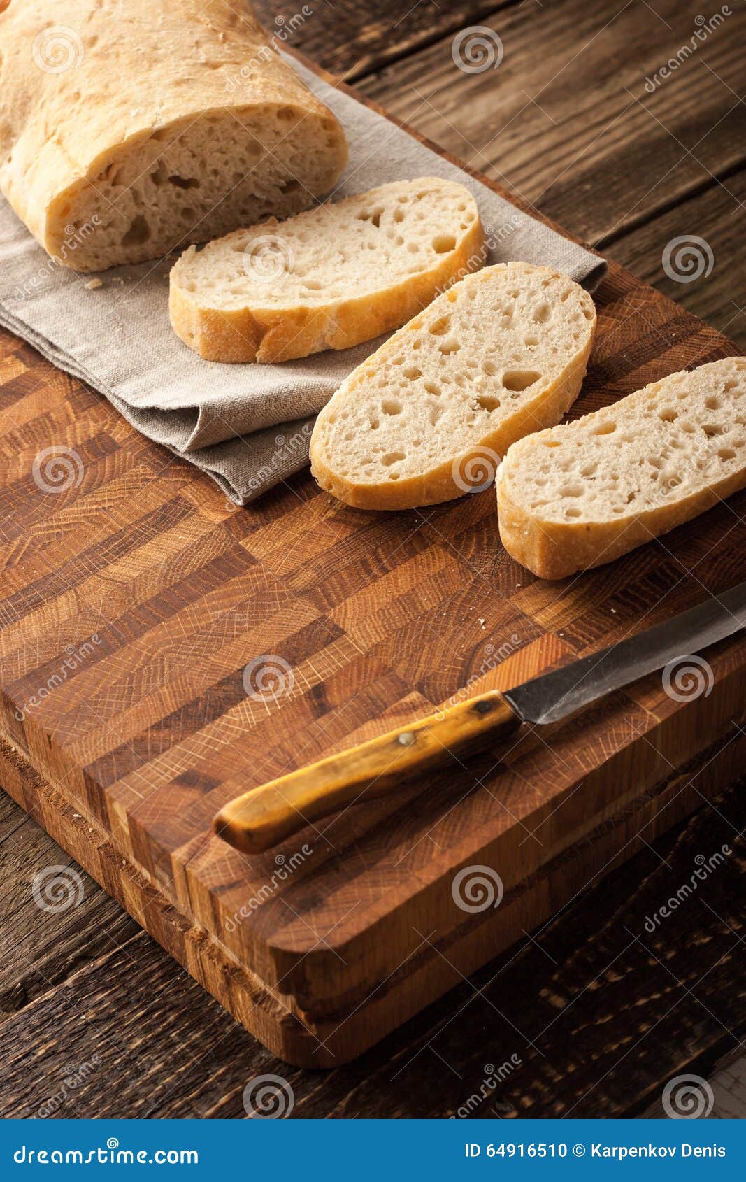 Sliced Bread on the Wooden Board Vertical Stock Photo - Image of ...