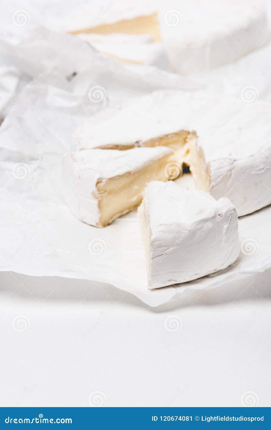 Sliced Brie Cheese on Crumpled Paper and Stock Image - Image of surface ...