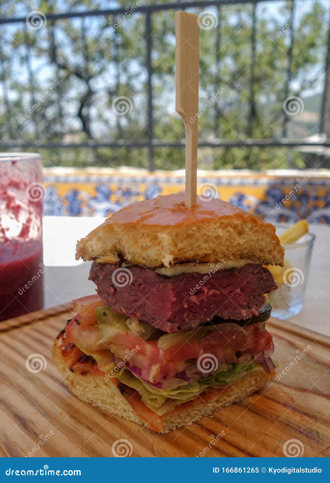 Sliced Burger Stack on Chopping Board Stock Image - Image of tomato ...