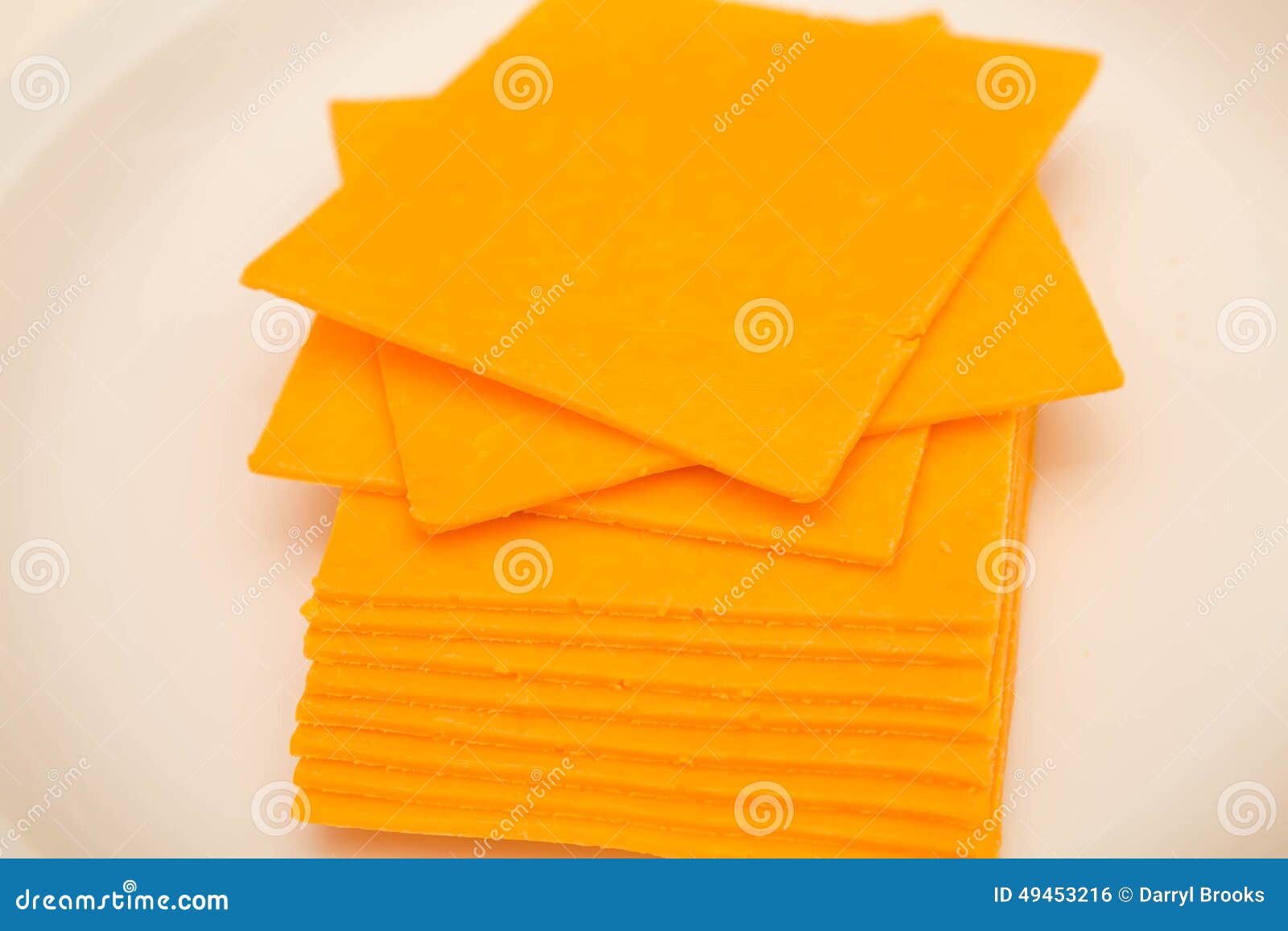 Sliced Cheddar Cheese on White Plate Stock Photo - Image of cheese ...