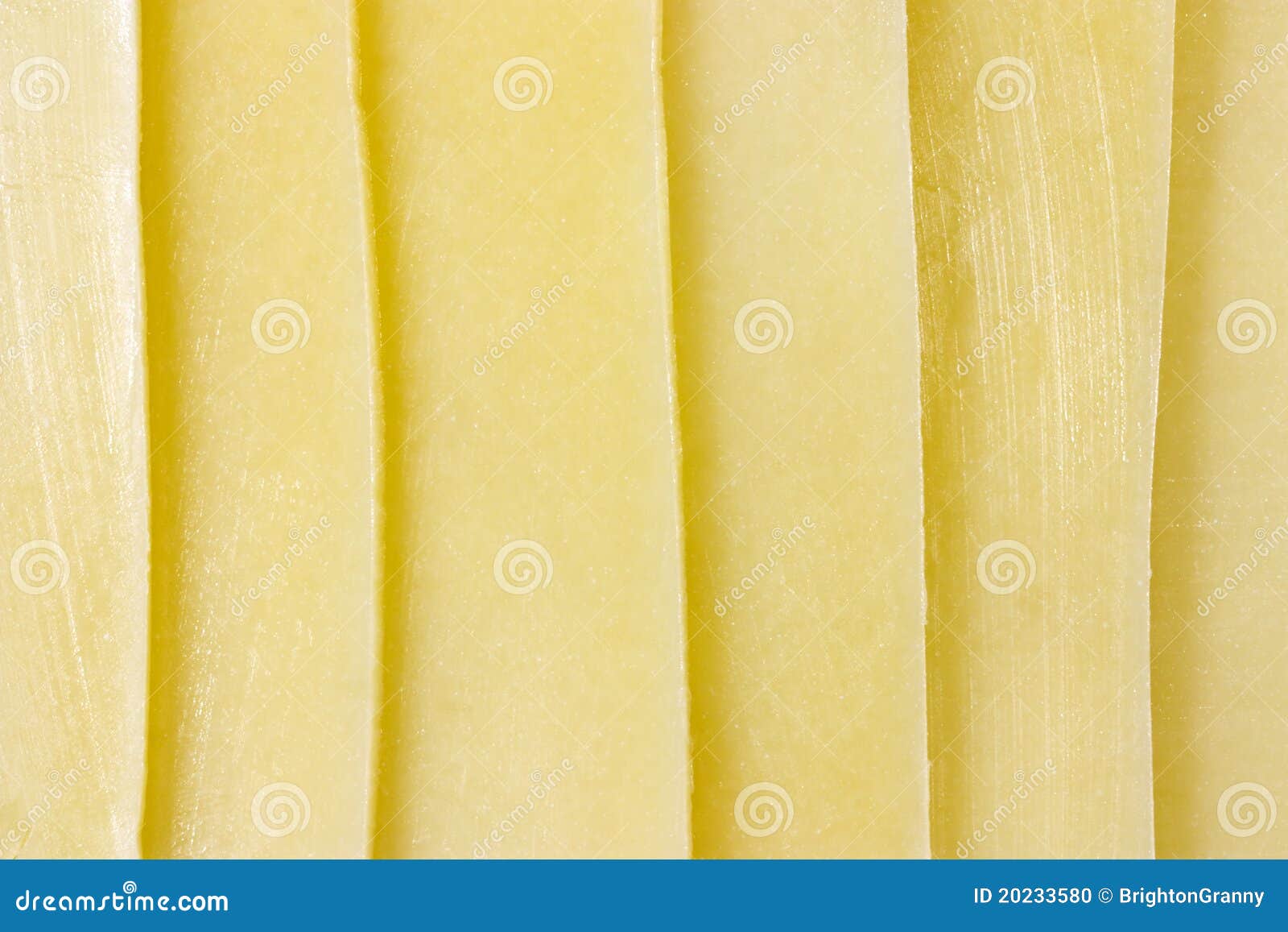 A Closeup of Cheddar Cheese Slices. Stock Photo - Image of sliced ...