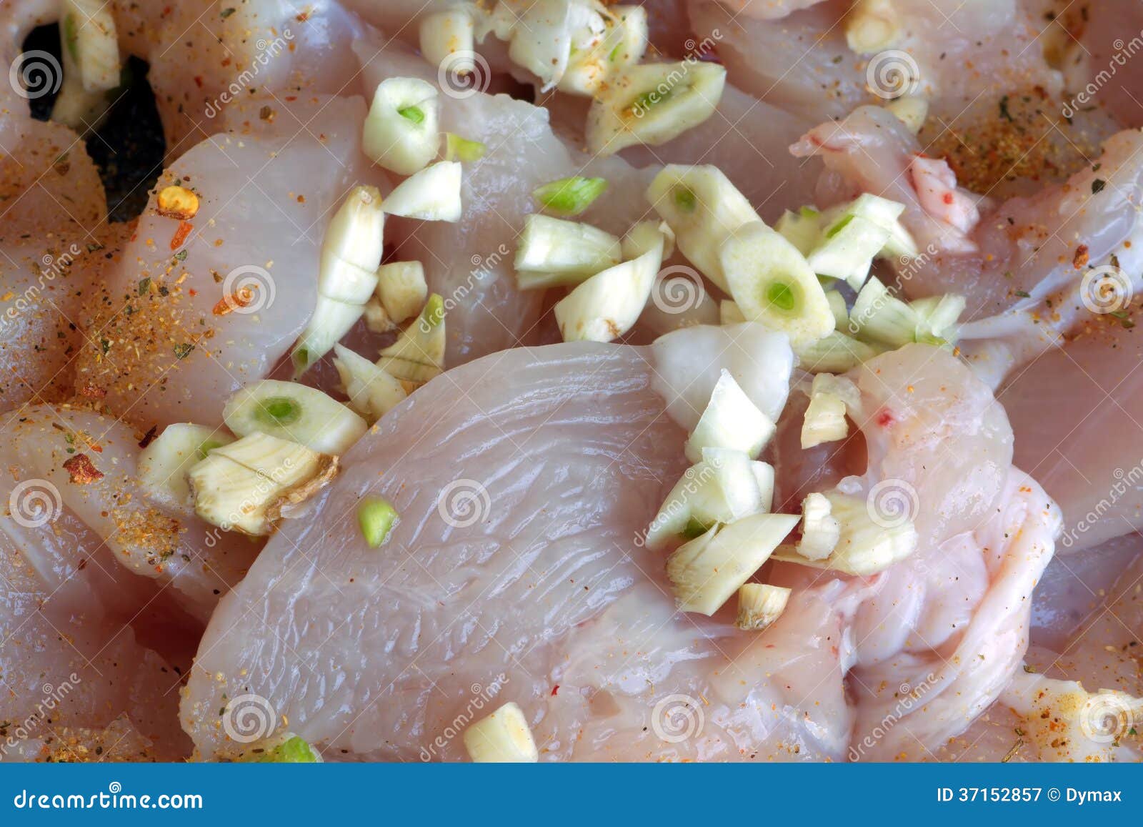 Sliced Chicken Meat with Spice and Garlic while Cooking Stock Image ...