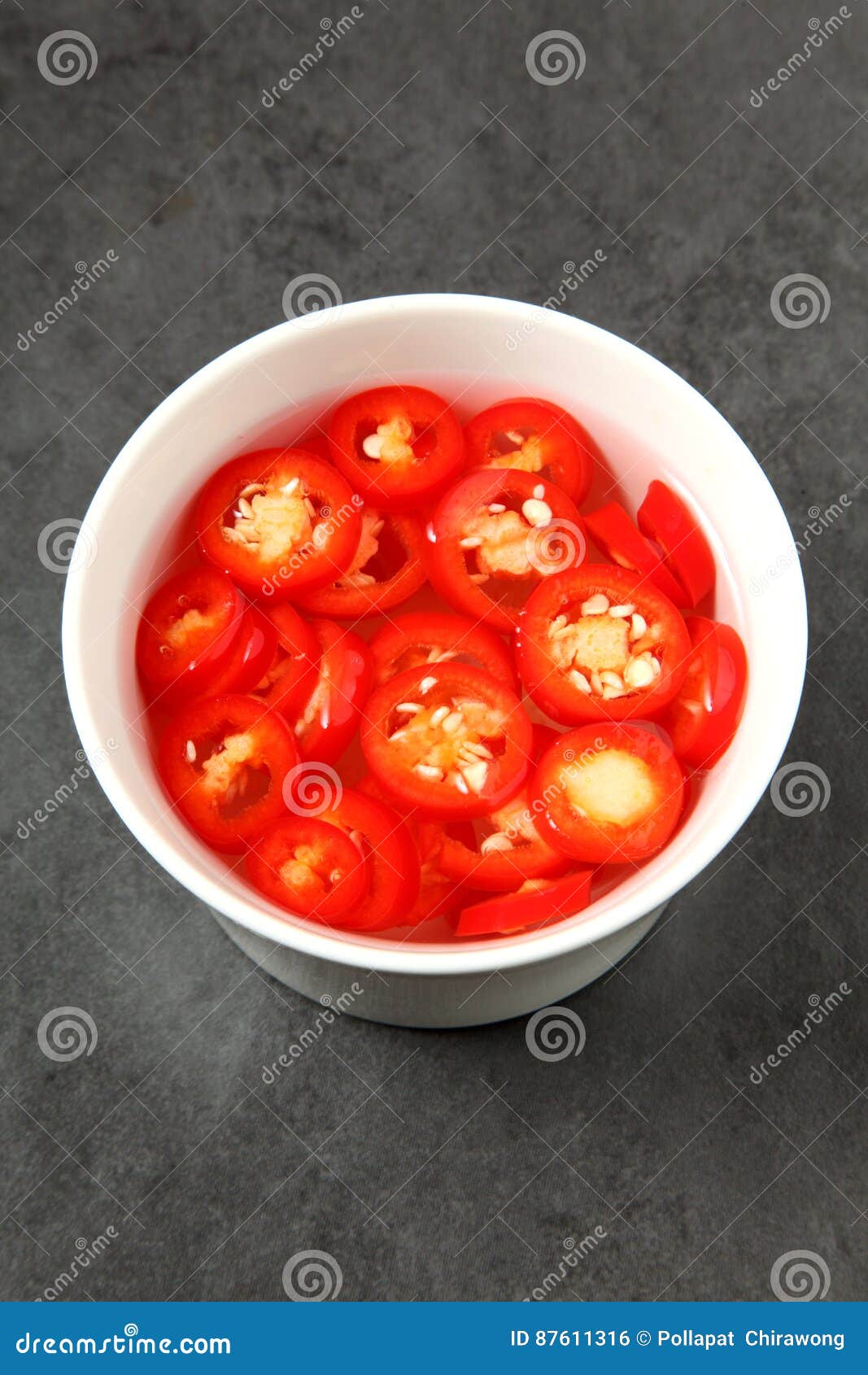Sliced chilli in the bowl stock photo. Image of vegetable - 87611316