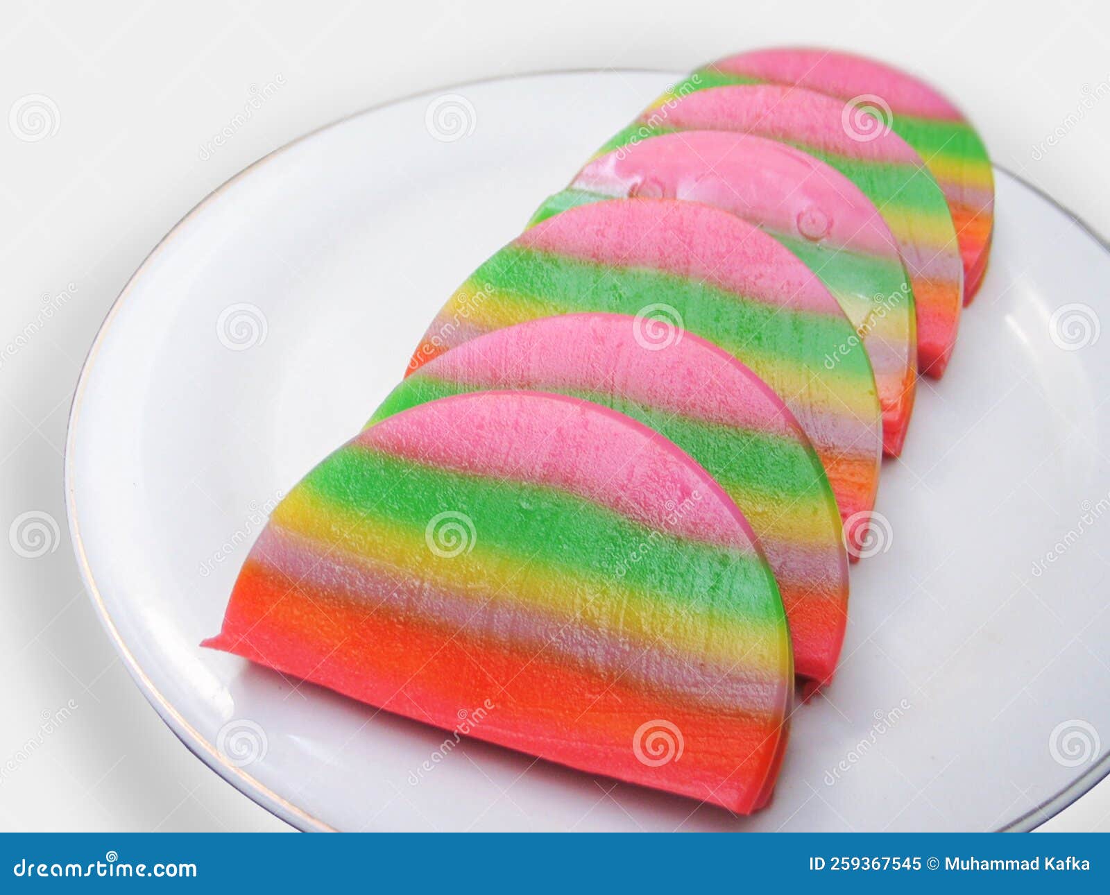 Sliced Colored Pudding Piled Up on a Clean White Plate from a Sideview ...