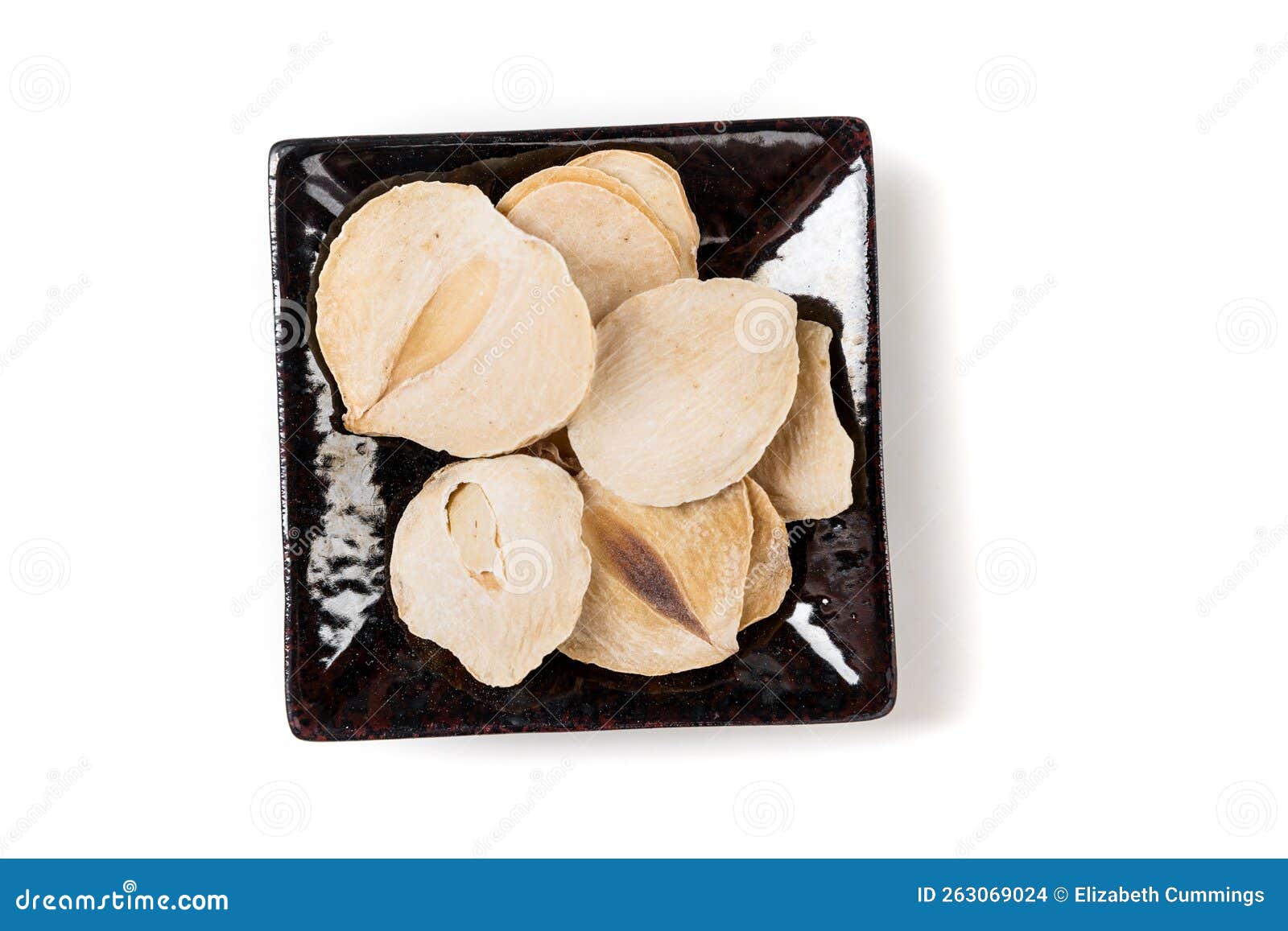 Sliced Dried Shallots in a Pile on a Black Tray Top Down Stock Photo ...