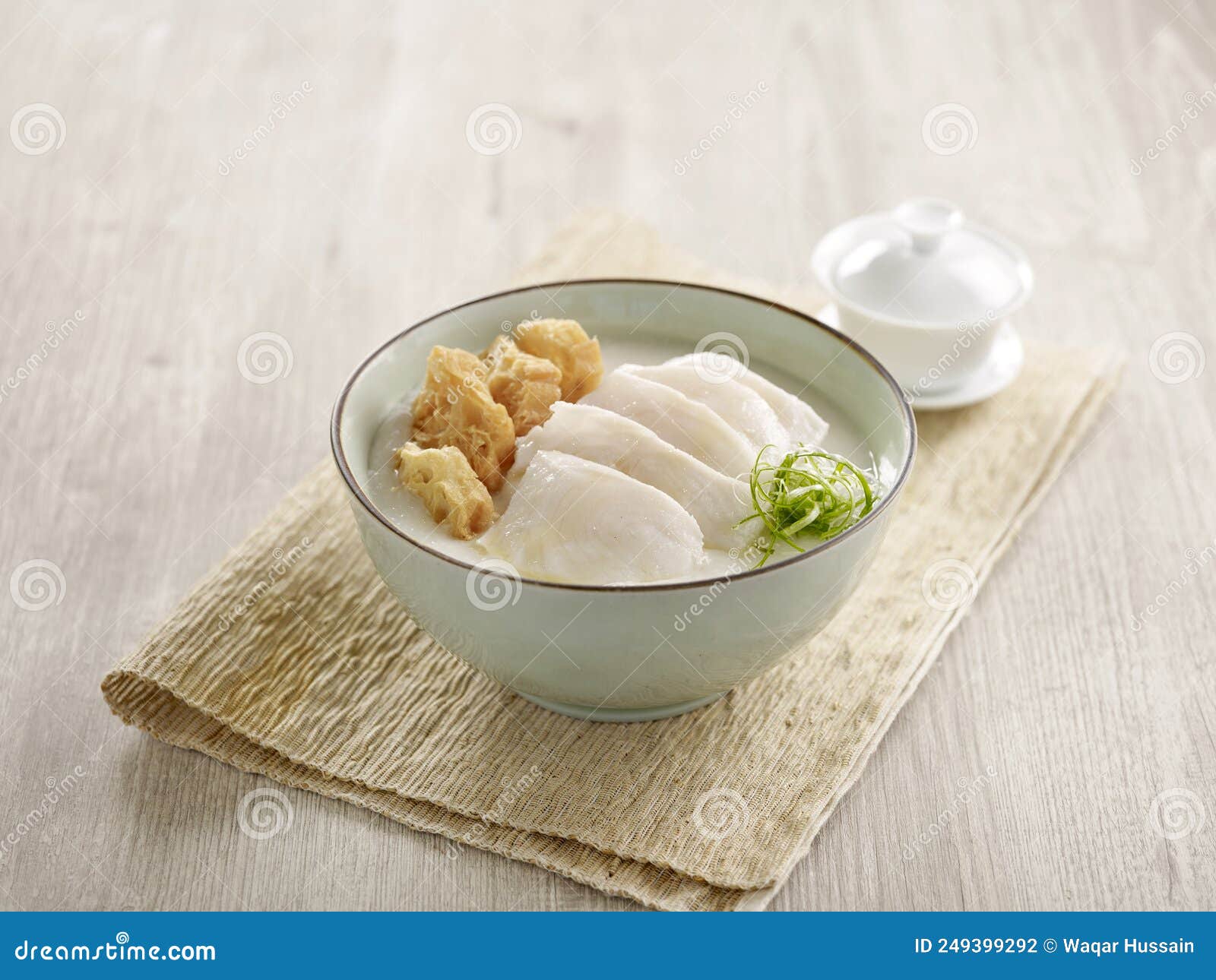 Sliced Fish Congee Served in a Dish Isolated on Mat Side View on Grey ...