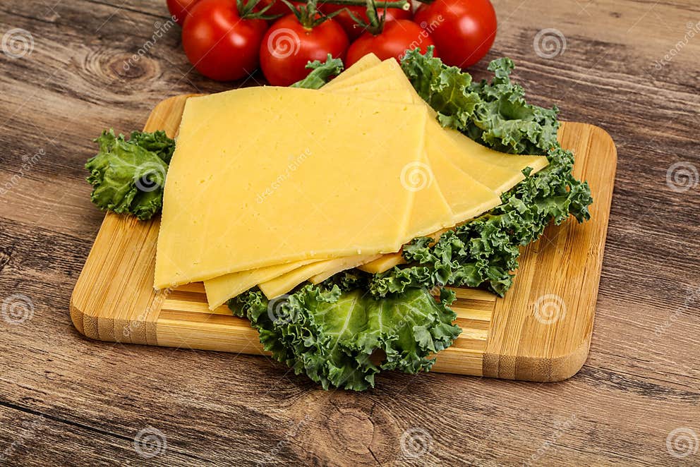 Sliced Gauda Cheese Over Board Stock Photo - Image of slice, cheese ...