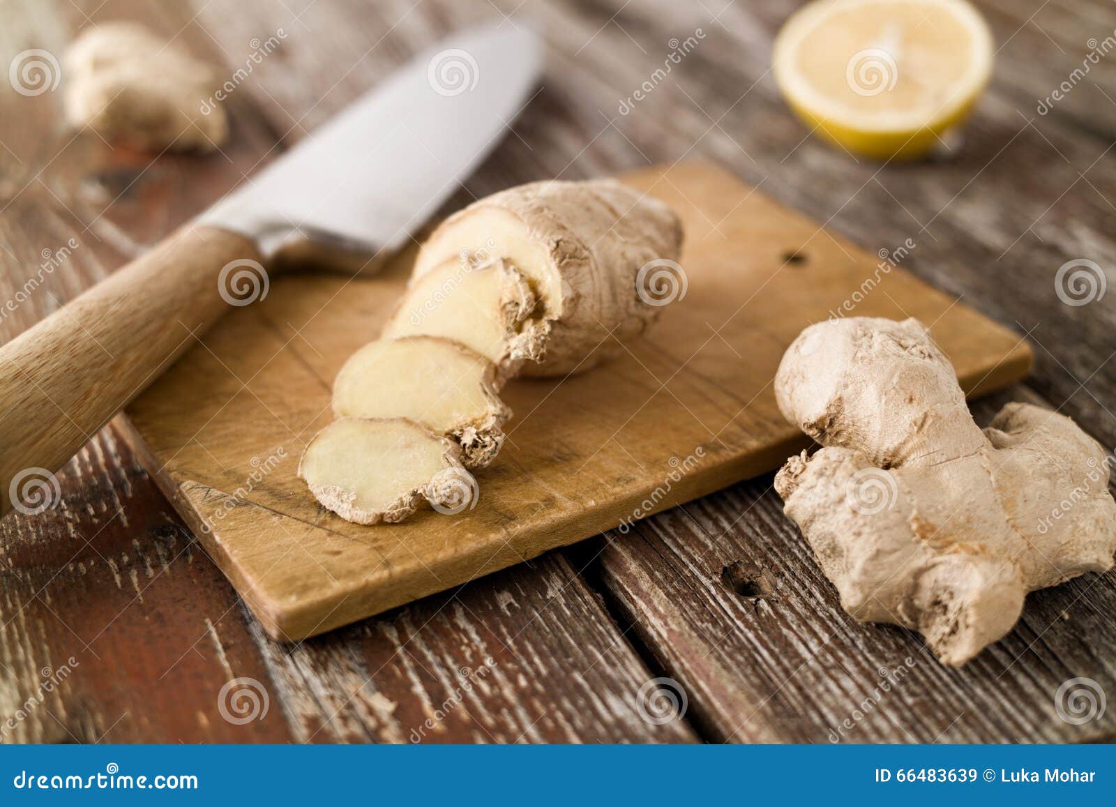 Sliced Ginger and Knife on Wood Cutting Board Rustic Setting Stock ...