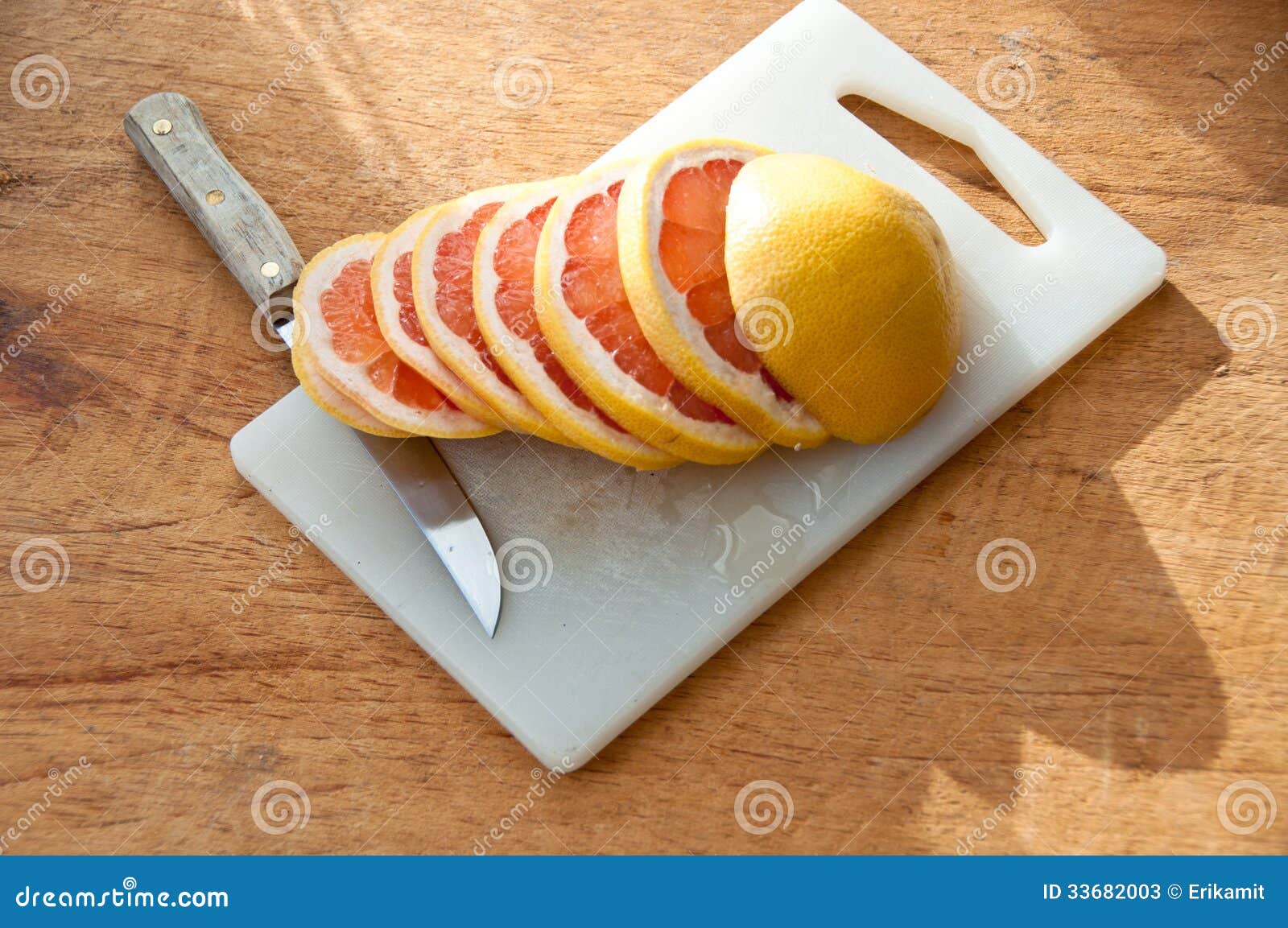 Sliced Grapefruit with Knife Stock Image - Image of snack, eating: 33682003