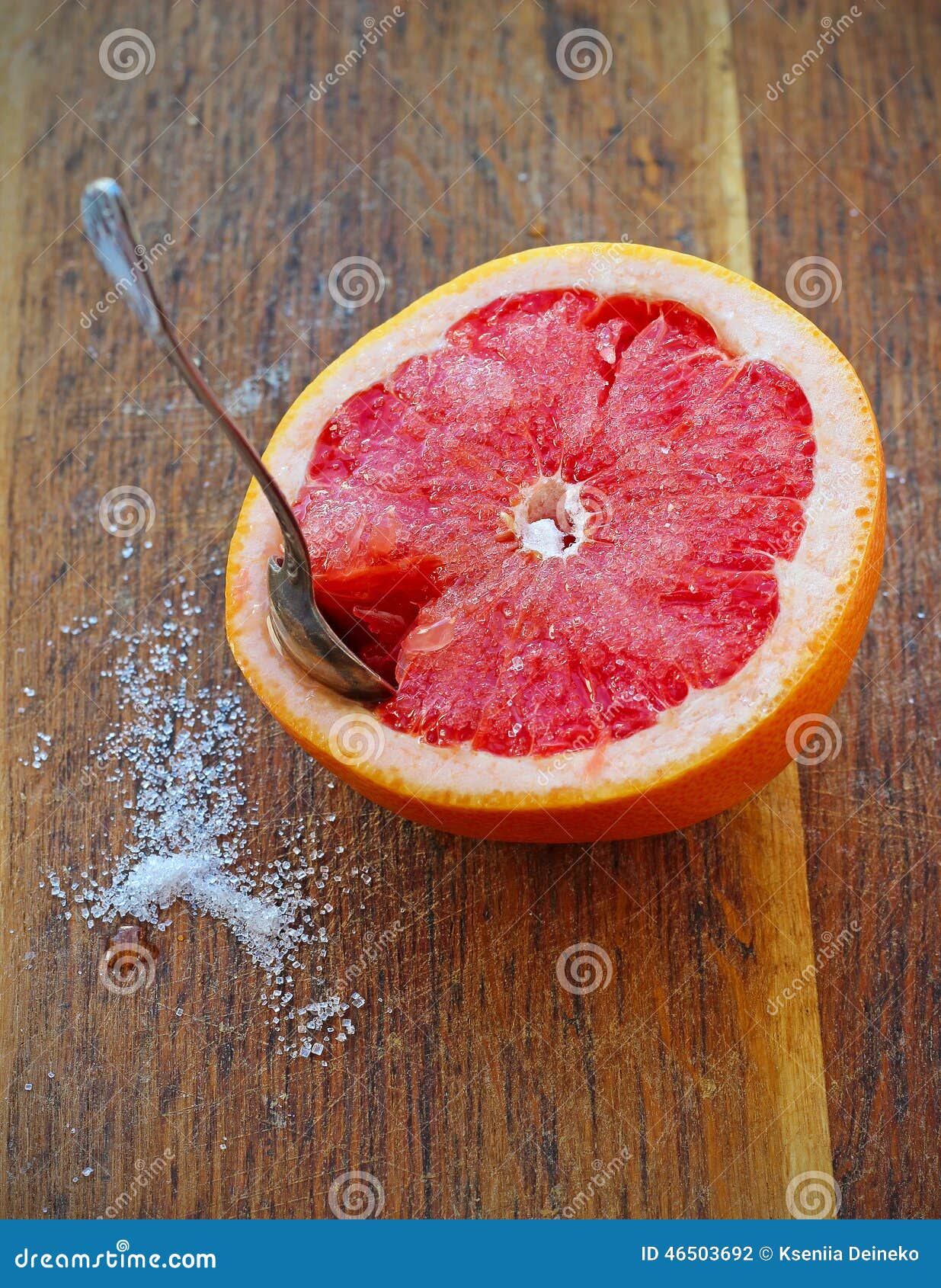 Sliced Grapefruit with Sugar on Wooden Plank Stock Photo - Image of ...