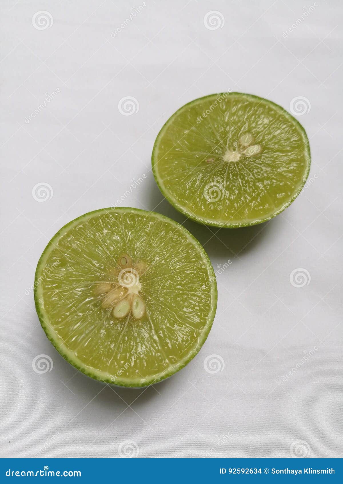 Sliced green lemons stock photo. Image of studio, health - 92592634