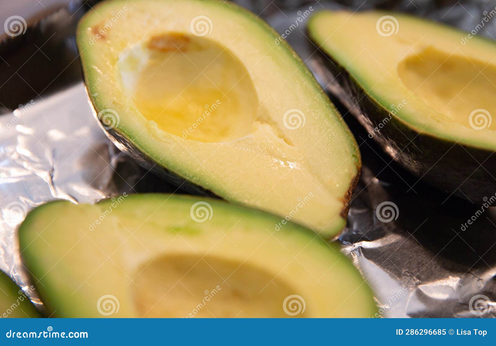 Sliced halves of Avocado stock image. Image of exotic - 286296685