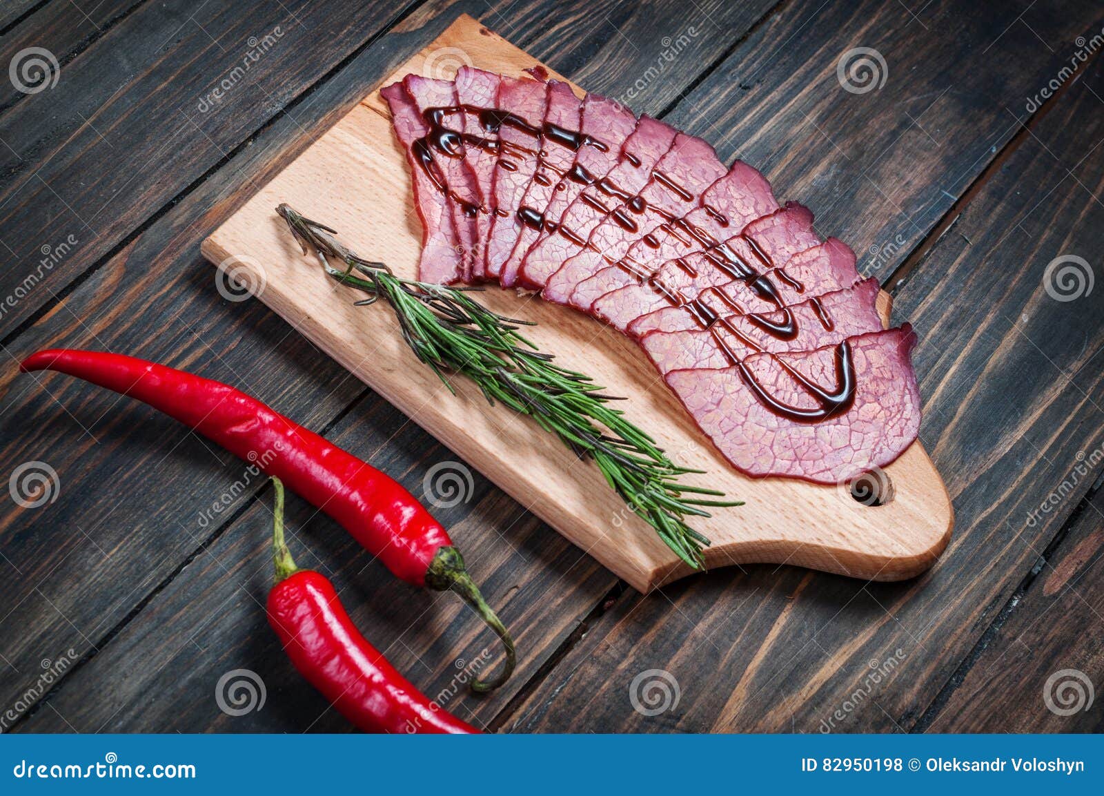 Sliced Ham, Chilli Pepper, Rosemary on a Wooden Board Stock Photo ...
