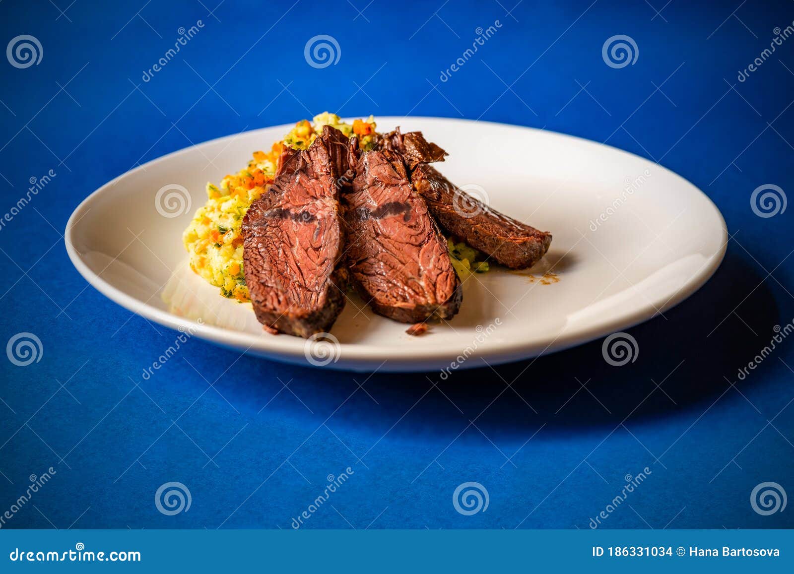 Sliced Hanger Steak Beef with Mashed Potato with Vegetable Stock Photo ...