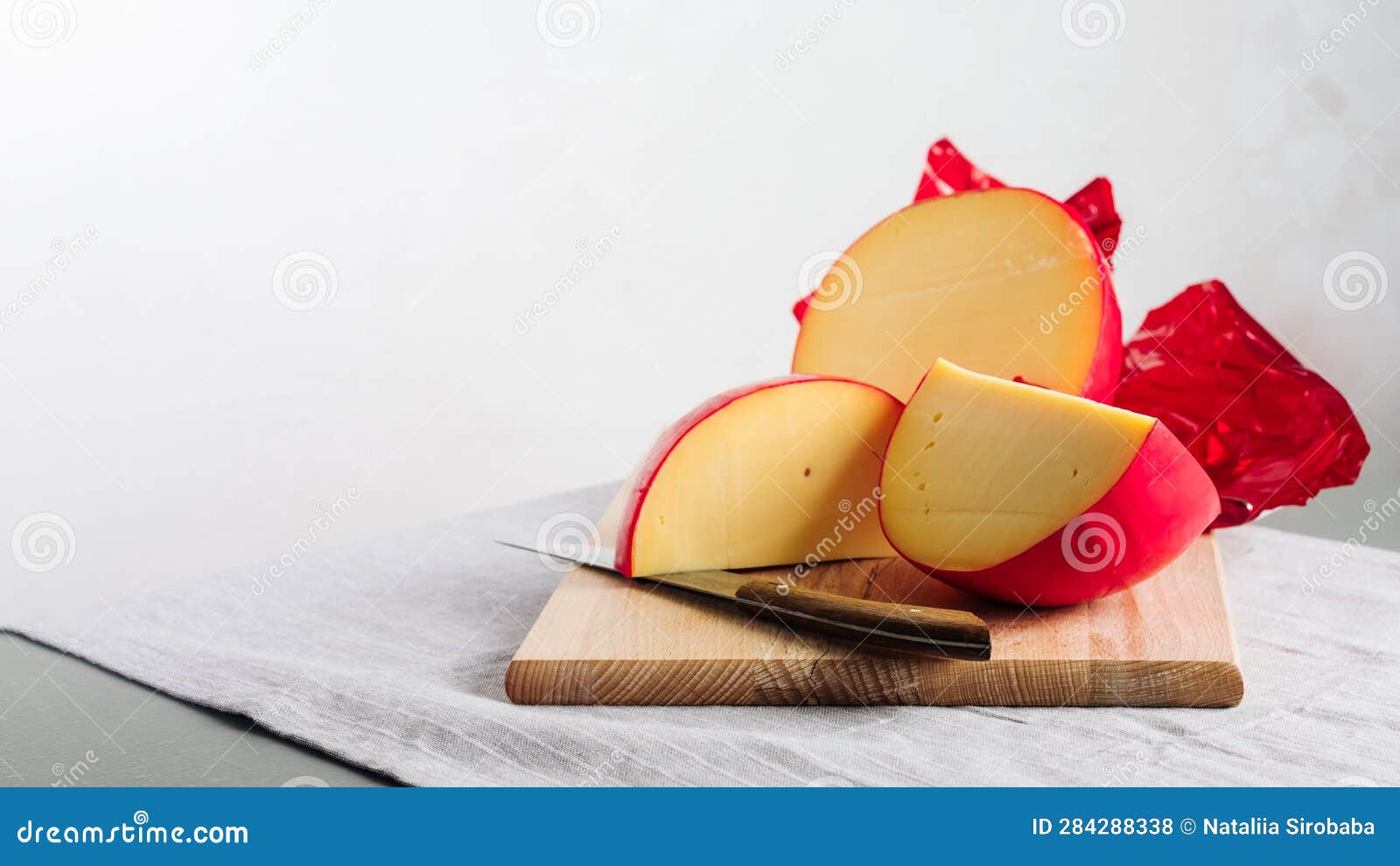 Sliced head of Edam cheese stock photo. Image of protein - 284288338