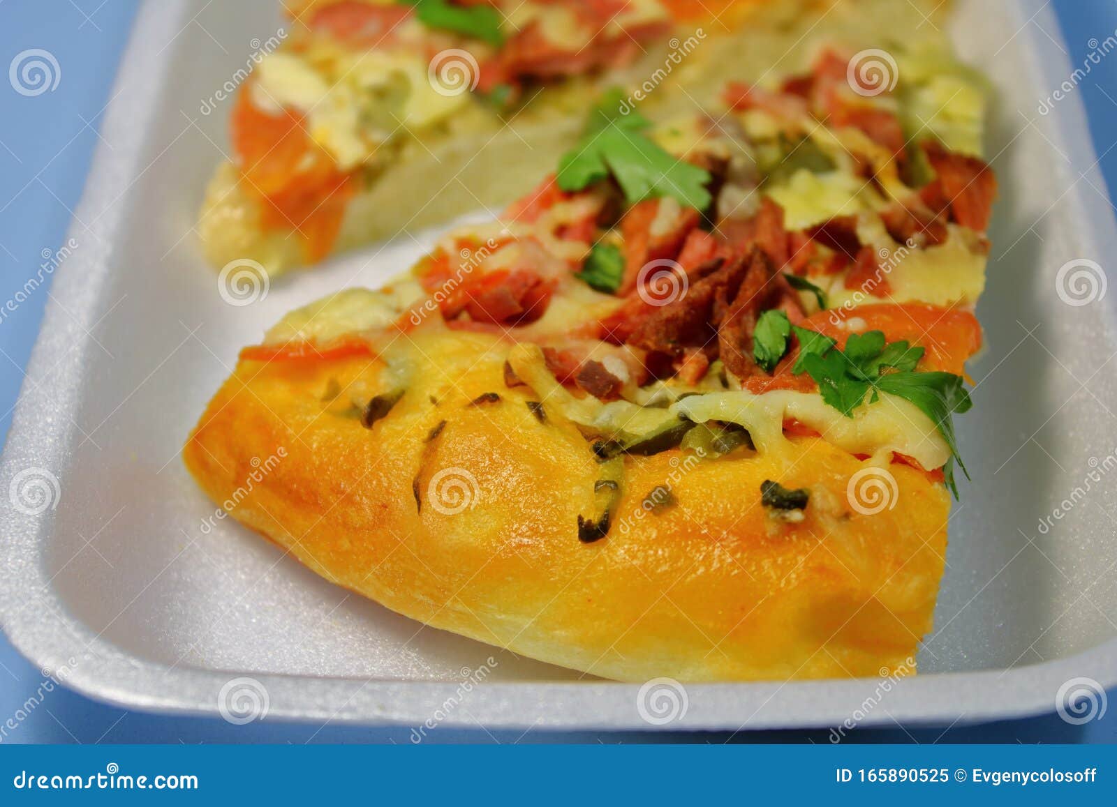Sliced Pieces of Pizza in Plastic Packaging on the Table. Stock Image ...