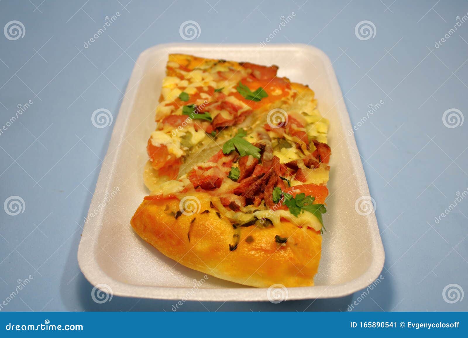 Sliced Pieces of Pizza in Plastic Packaging on the Table. Stock Image ...