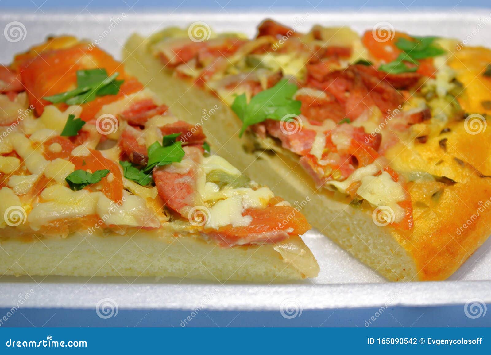 Sliced Pieces of Pizza in Plastic Packaging on the Table. Stock Photo ...