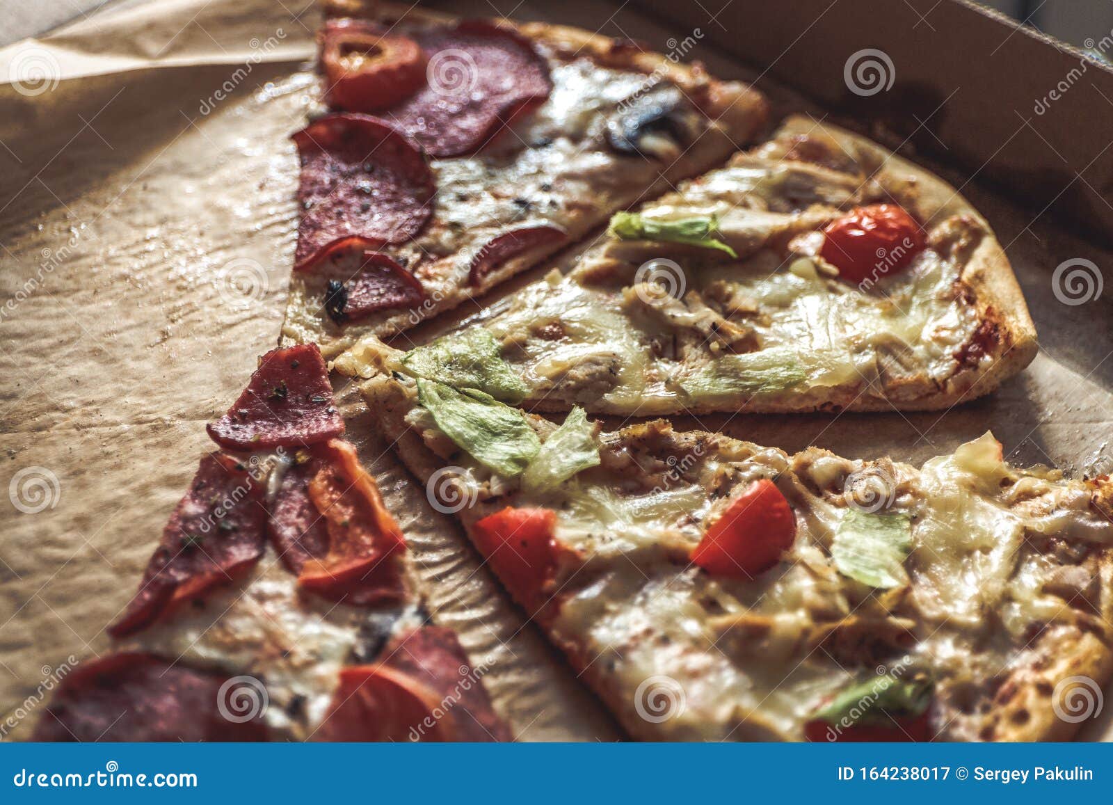 Sliced Sliced Pizza in a Box on Parchment Paper. Stock Image - Image of ...