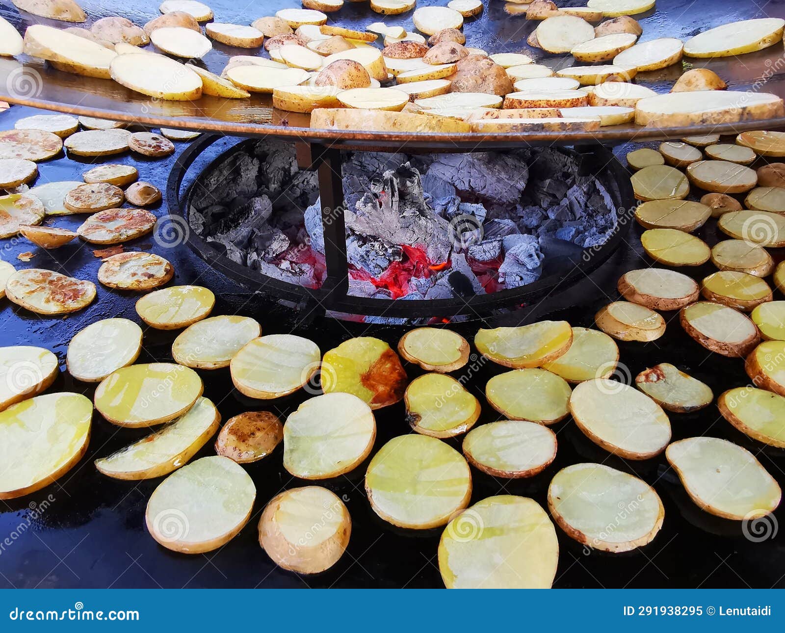 Sliced Potatoes on the Hot Plate - Hot Embers Stock Image - Image of ...