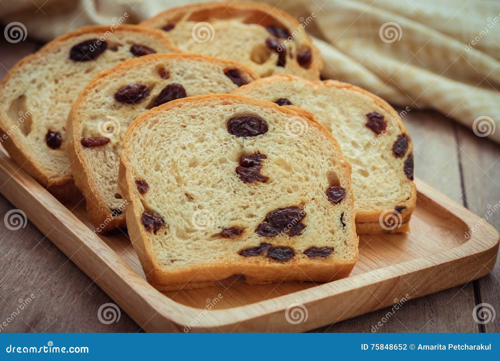 Sliced Raisin Bread on Wooden Plate Stock Photo - Image of wooden ...