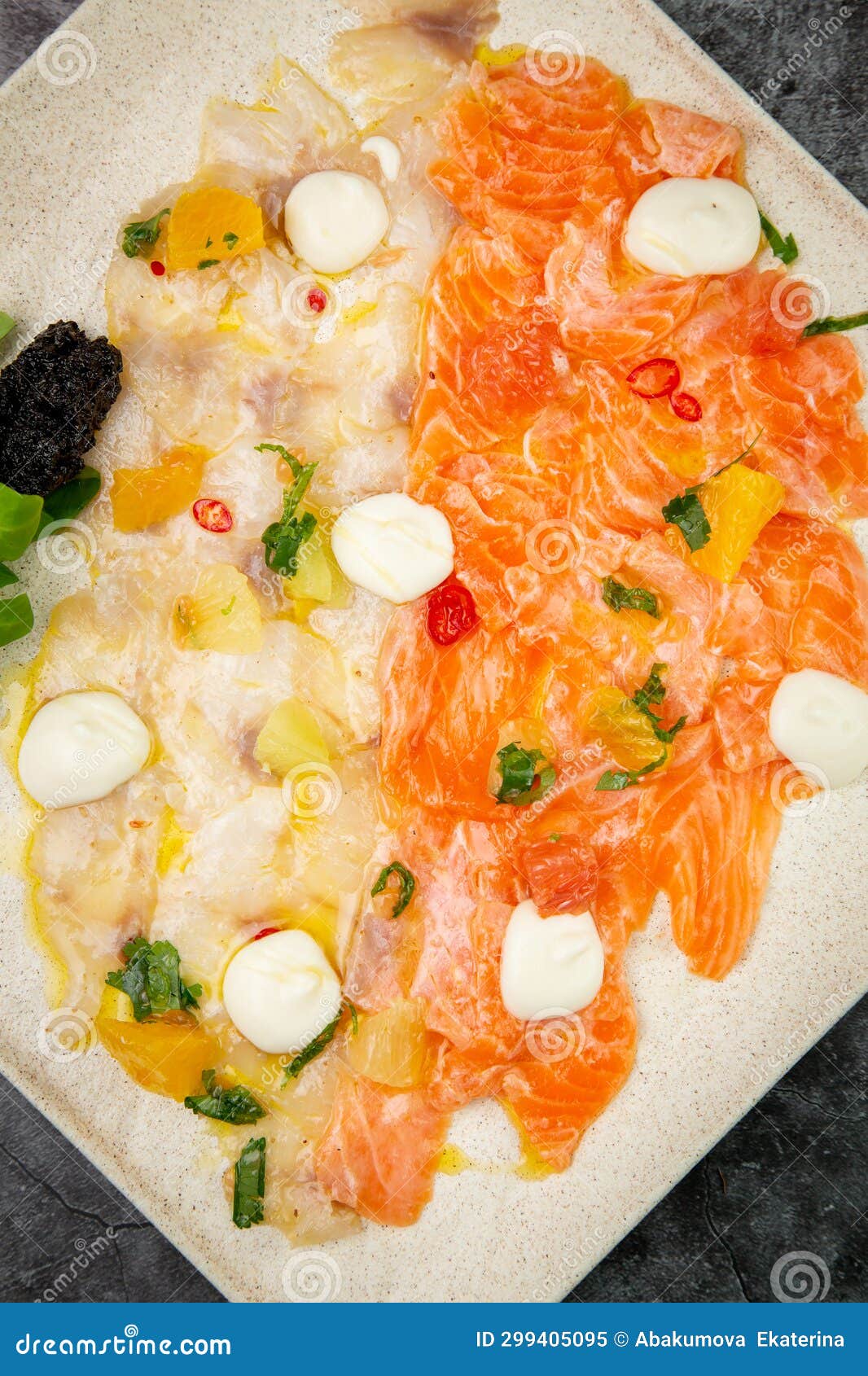 Sliced Red and White Fish with Mozzarella Cheese and Herbs, Top View ...