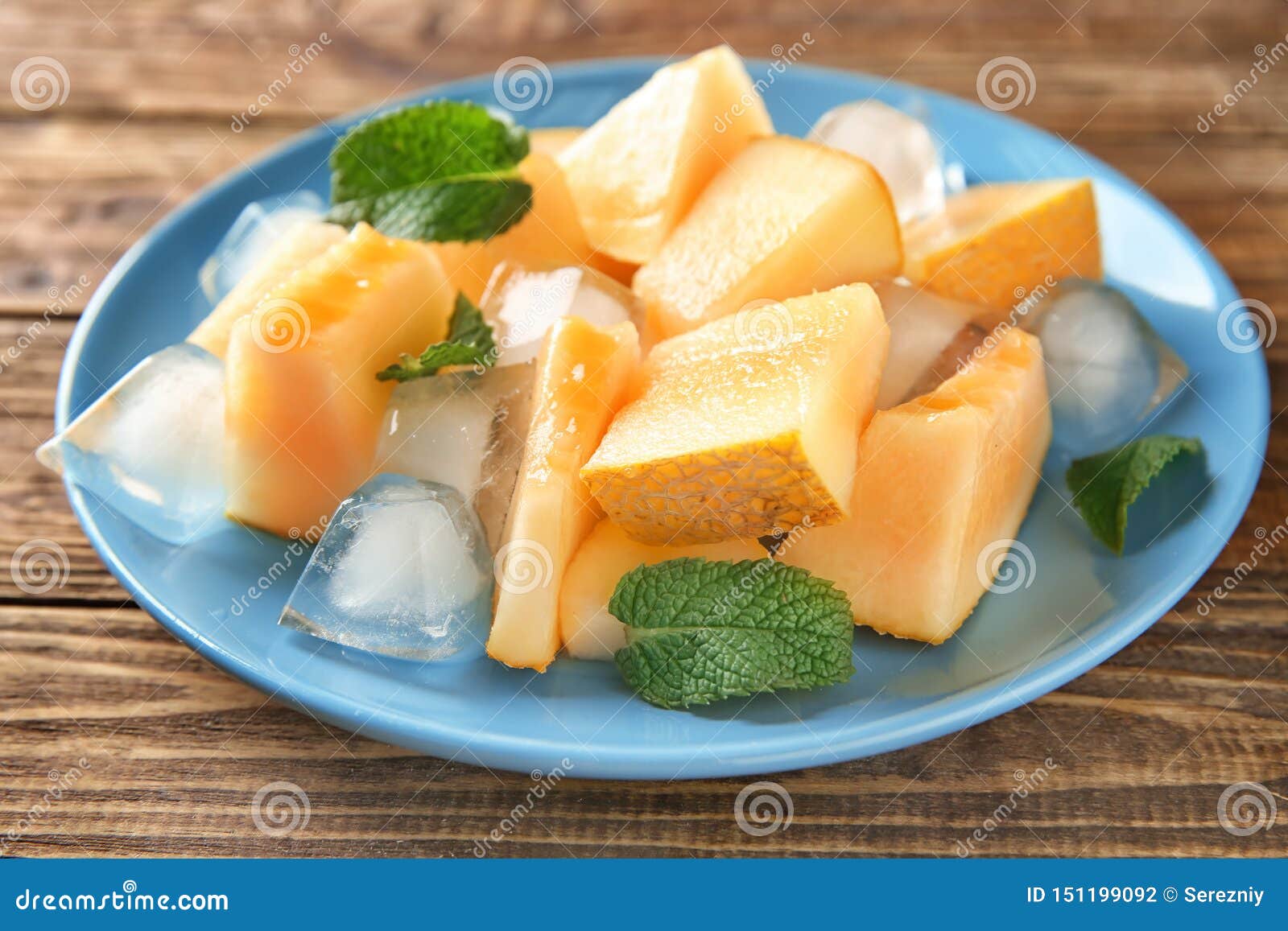 Sliced Ripe Melon with Ice Cubes on Plate Stock Photo - Image of piece ...