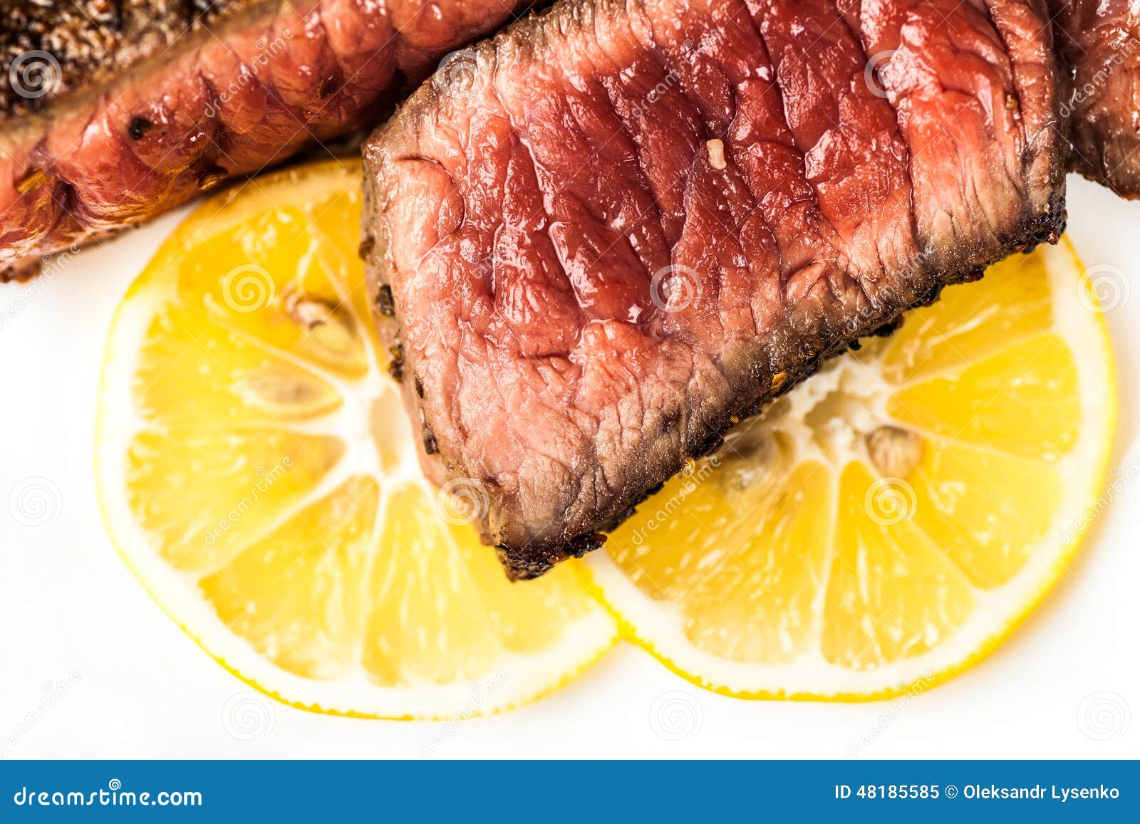 Sliced Roasted Meat with Slices of Lemon Stock Image - Image of closeup ...