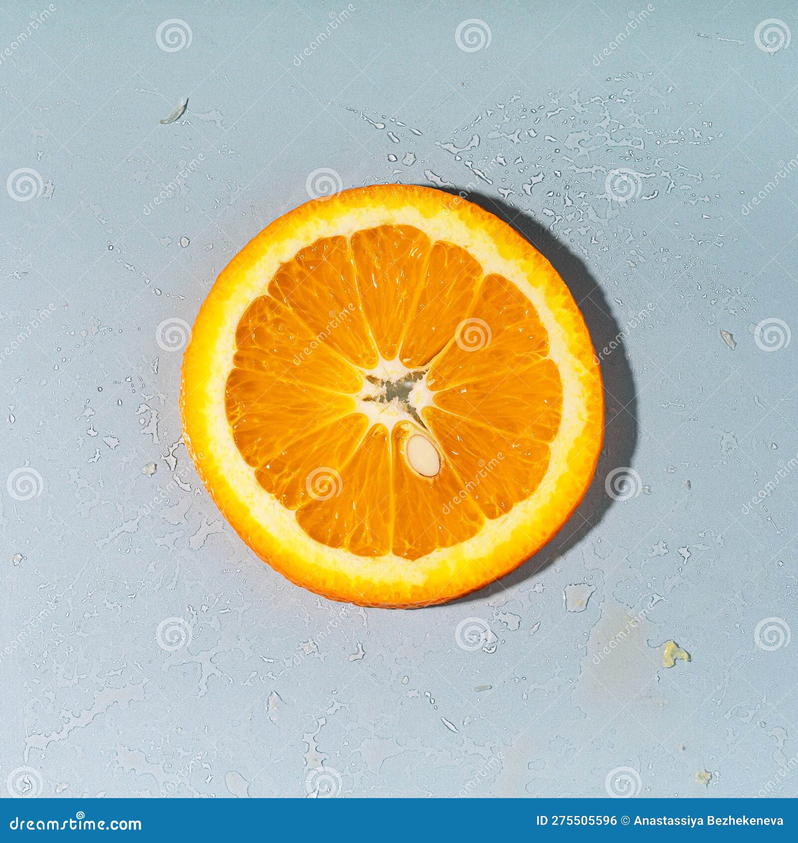 Sliced Round Piece of Orange with Pit on Gray Background Stock Photo ...