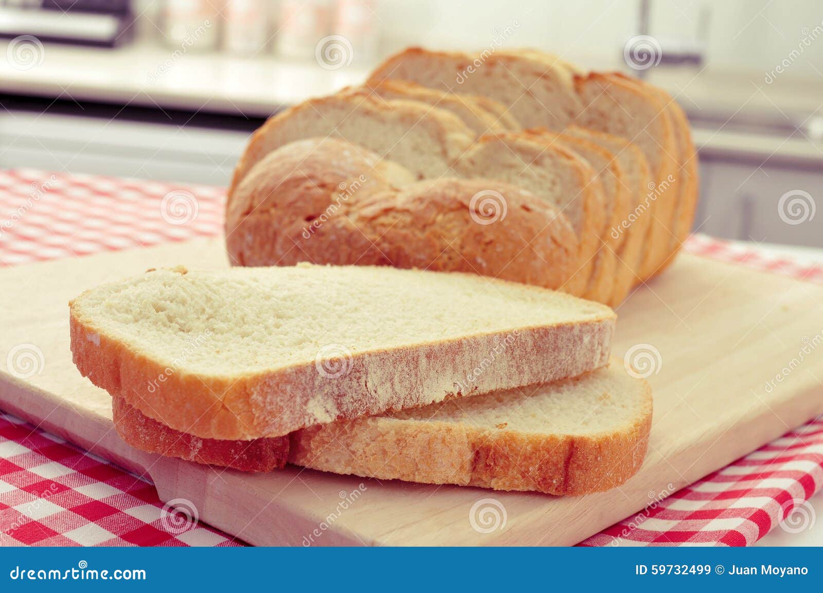 Sliced Spanish Loaf of Bread on the Kitchen Table Stock Image - Image ...