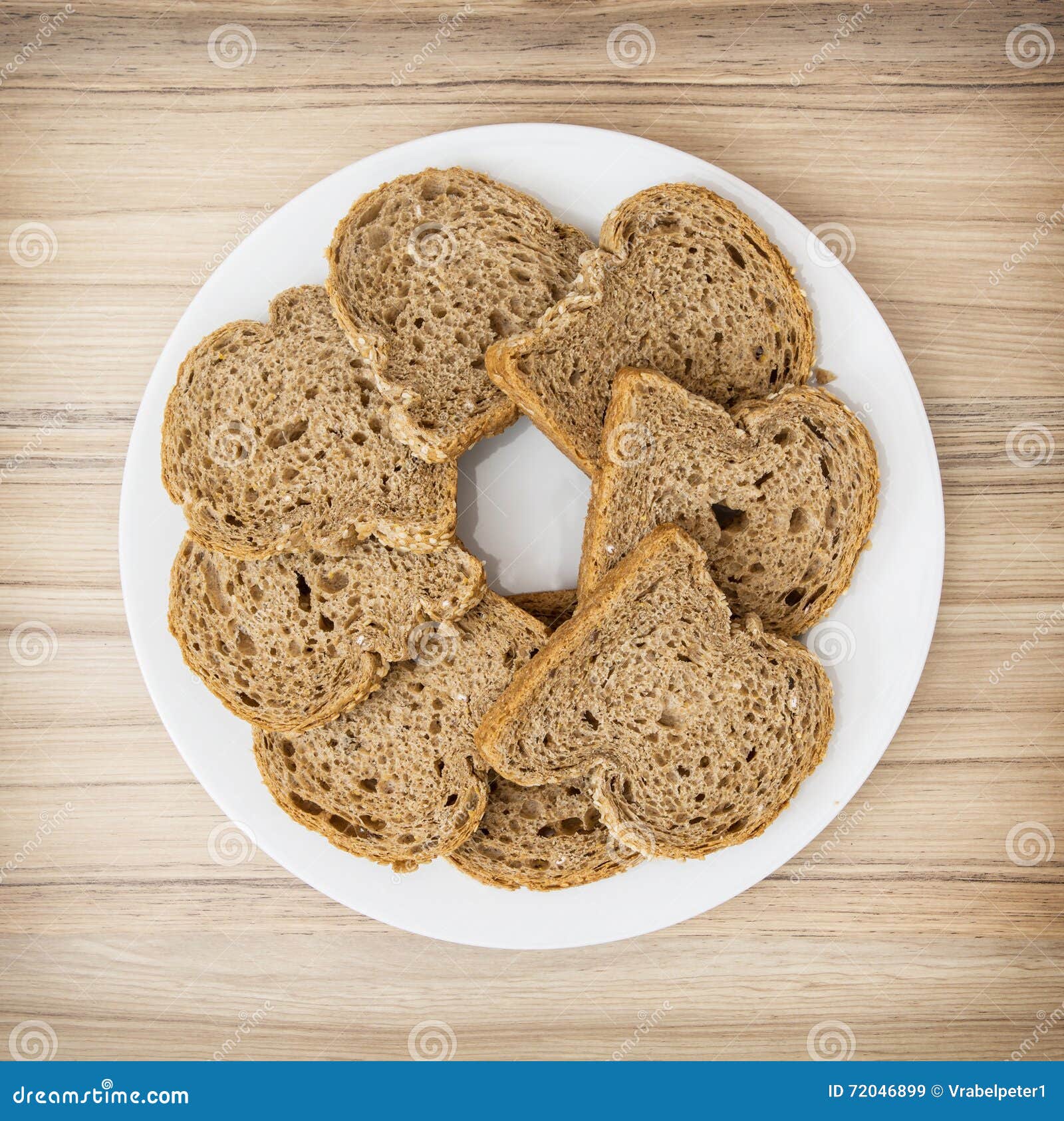 Sliced Wheaten Bread in Circle Shape on the White Plate Stock Image ...