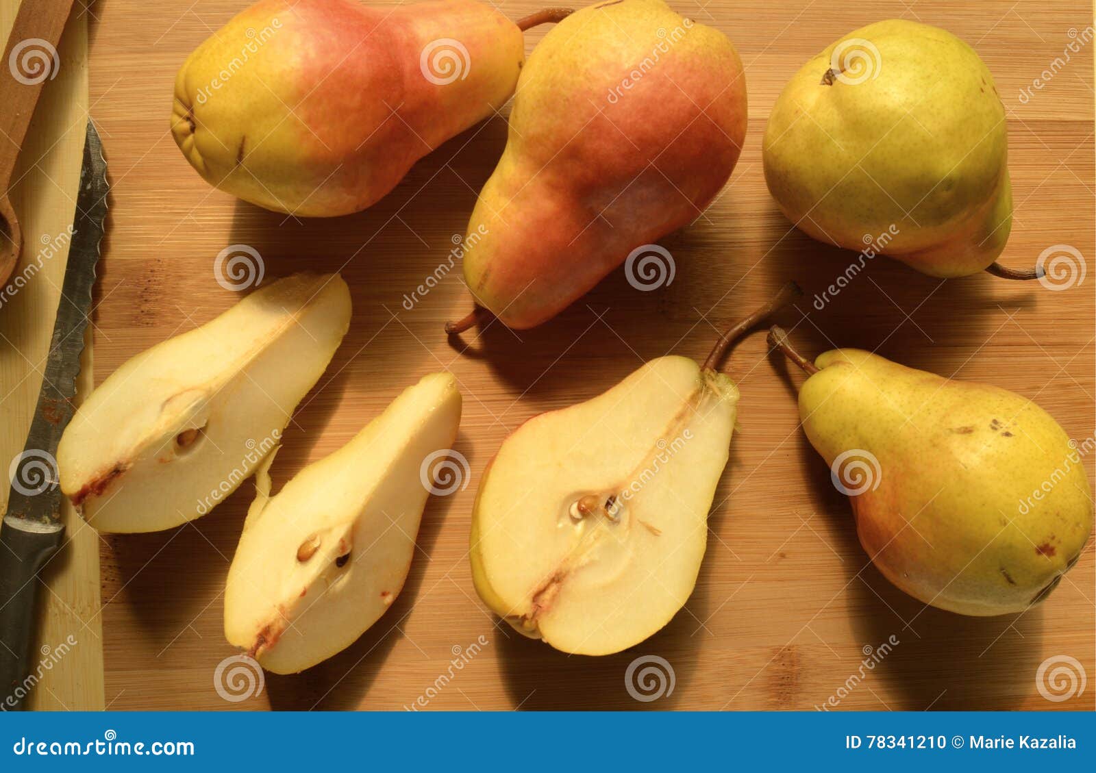 Sliced and Whole Pears on Cutting Board Overhead View Stock Photo ...
