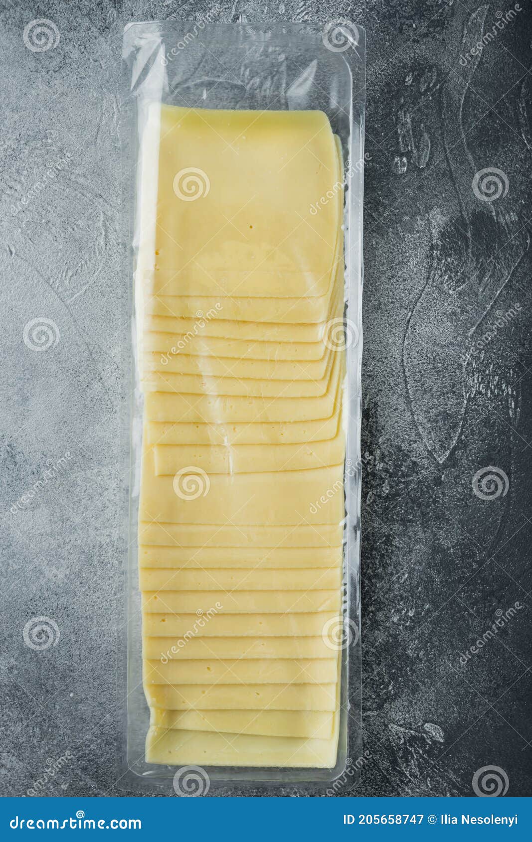 Slices of American Cheese in Plastic Pack, on Gray Background Stock ...