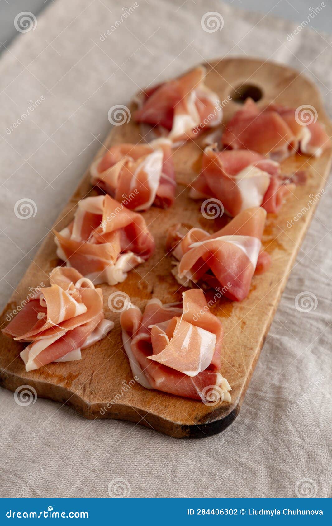 Slices of Appetizing Jamon Serrano Ready To Eat on a Rustic Wooden ...