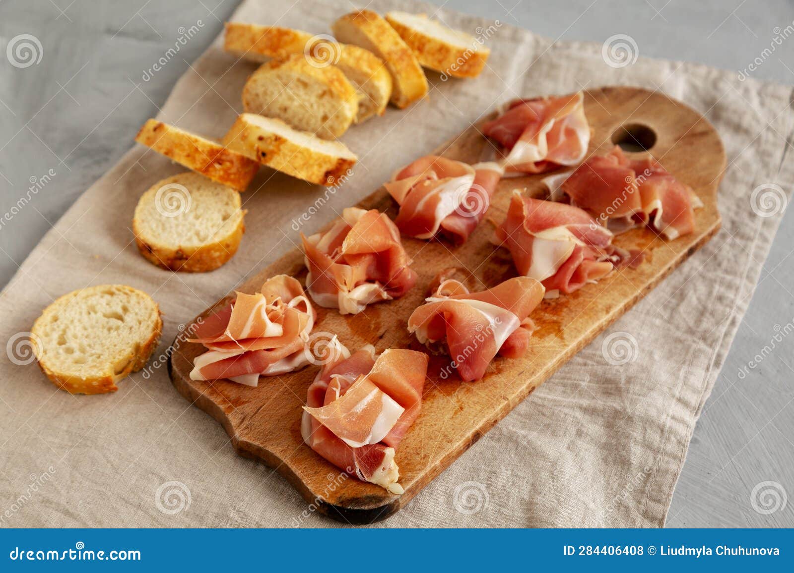Slices of Appetizing Jamon Serrano Ready To Eat on a Rustic Wooden ...